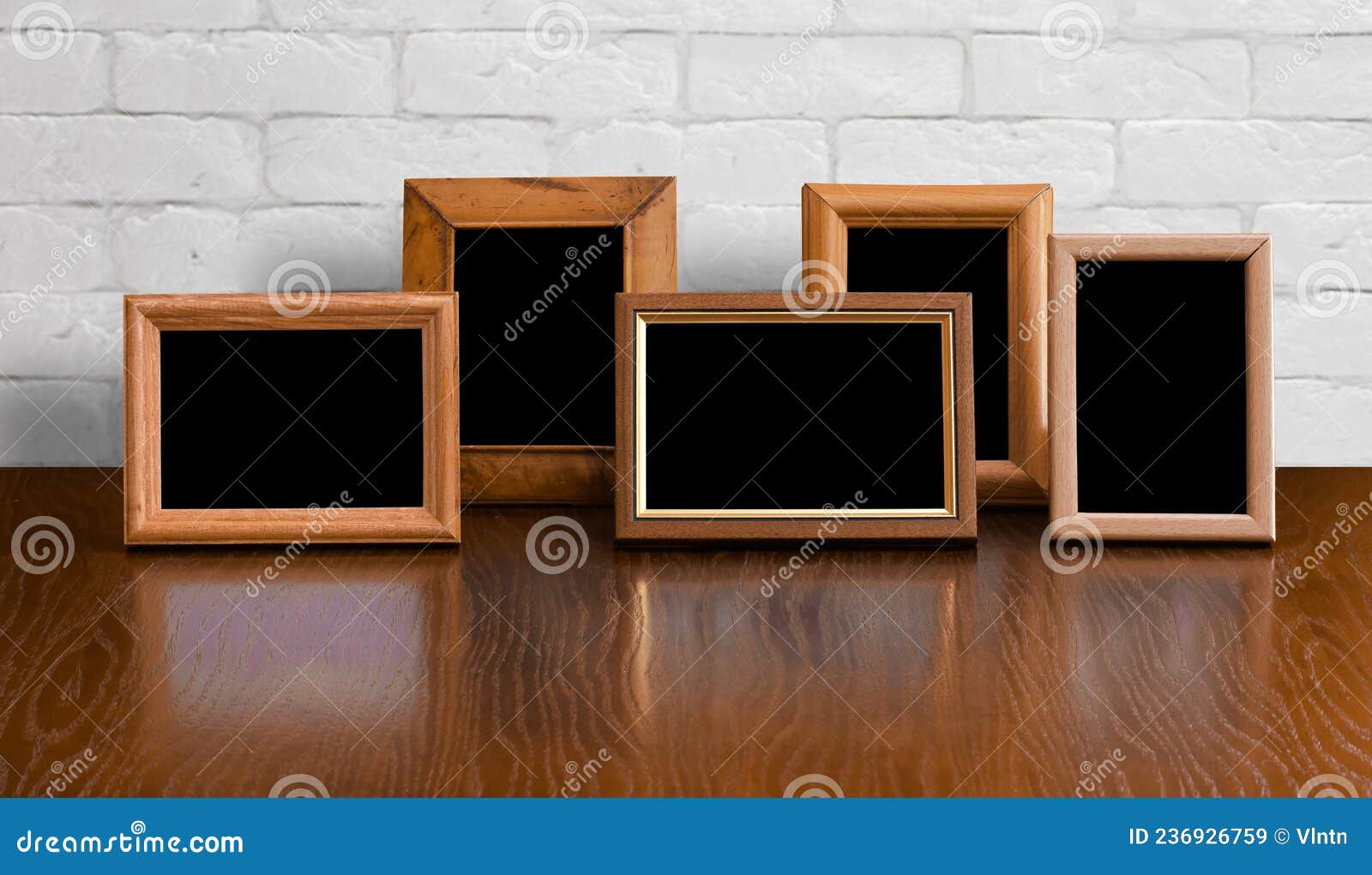 Photo frames on the table stock image. Image of room - 236926759