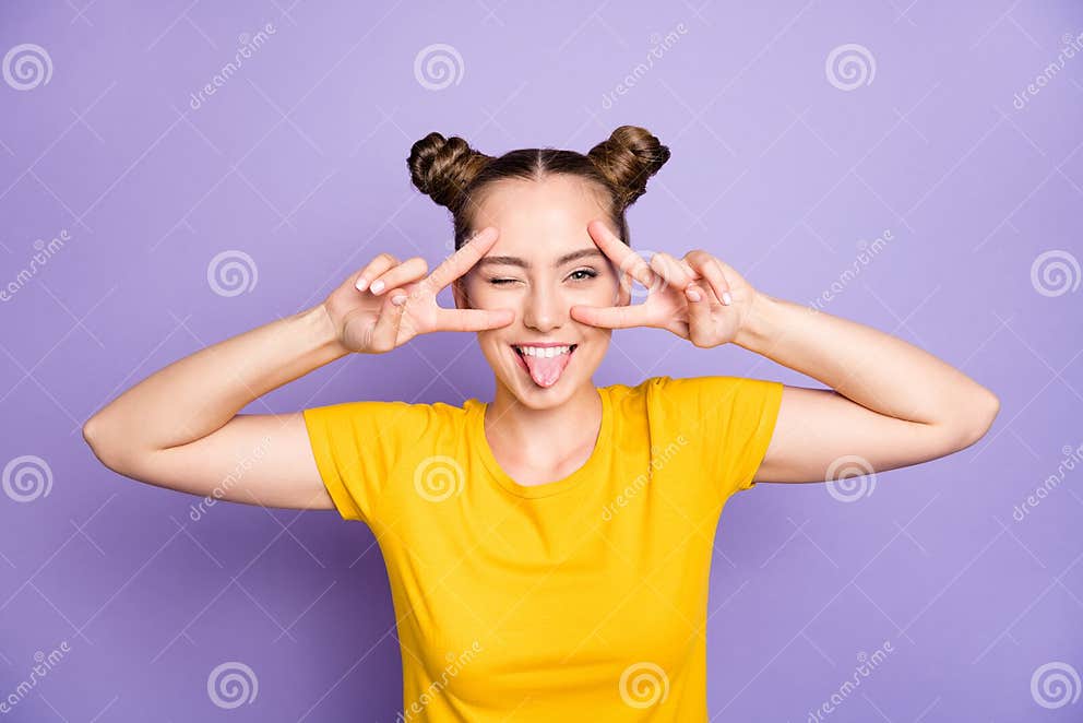 Photo Of Funky Teenager Lady Holding Hands Near Eyes Showing V Sign