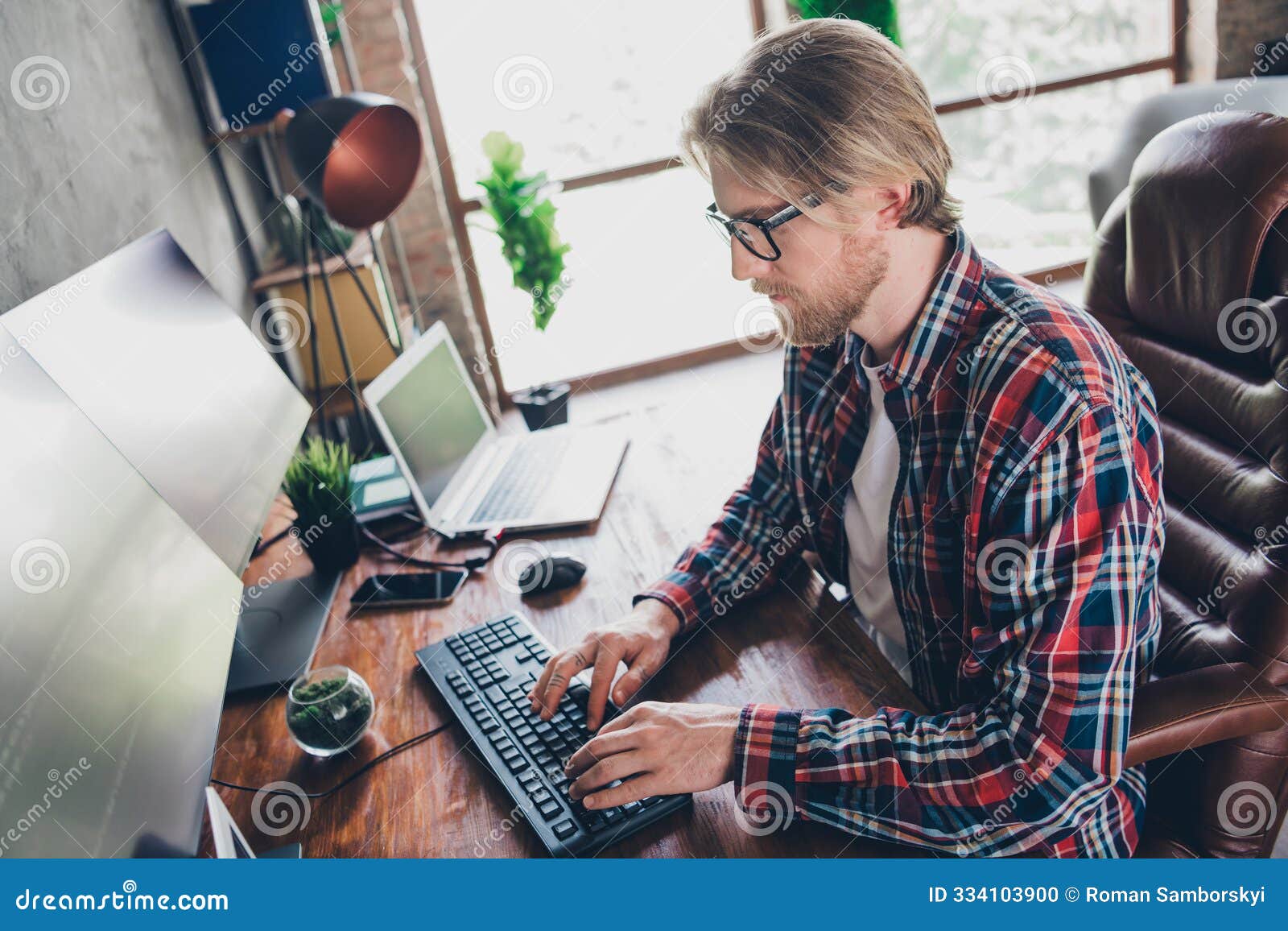 Photo of Geek Young Blond Hair Hacker Guy at Loft Design Modern Office ...