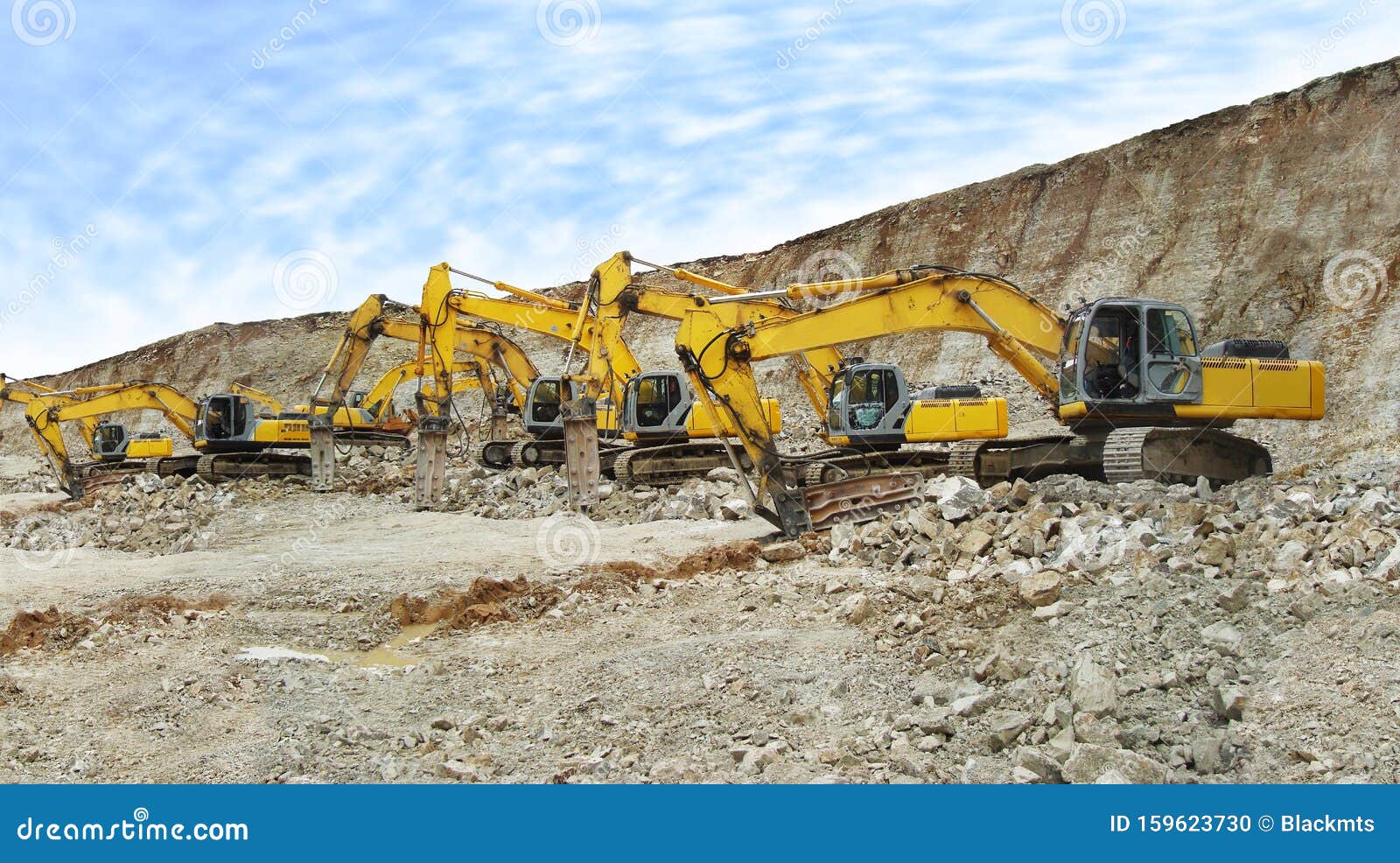Group of Machines with a Hydraulic Hammer Mining Rubble at the Quarry ...