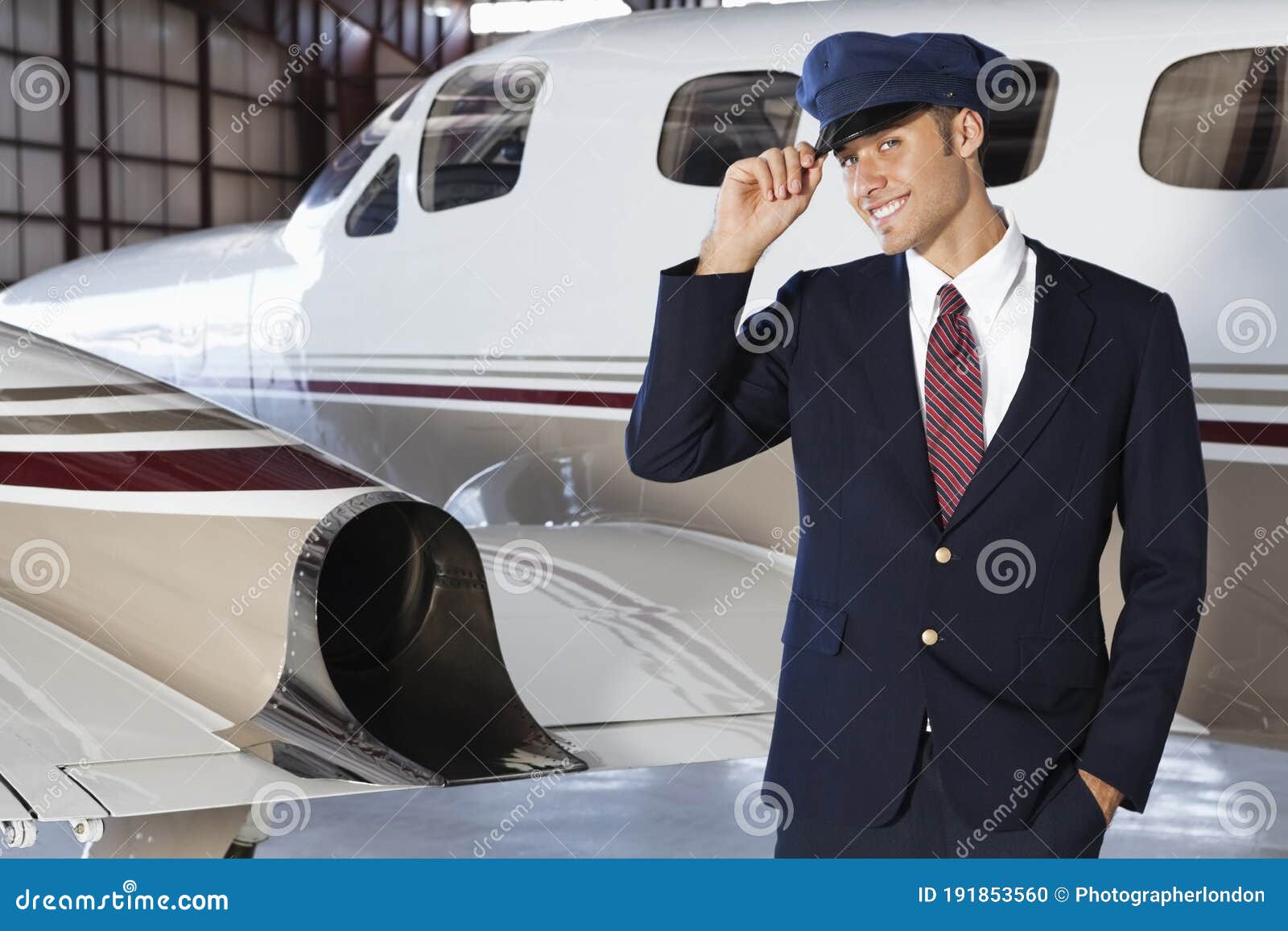 Portrait of Handsome Young Pilot Standing in Front of Private Airplane ...