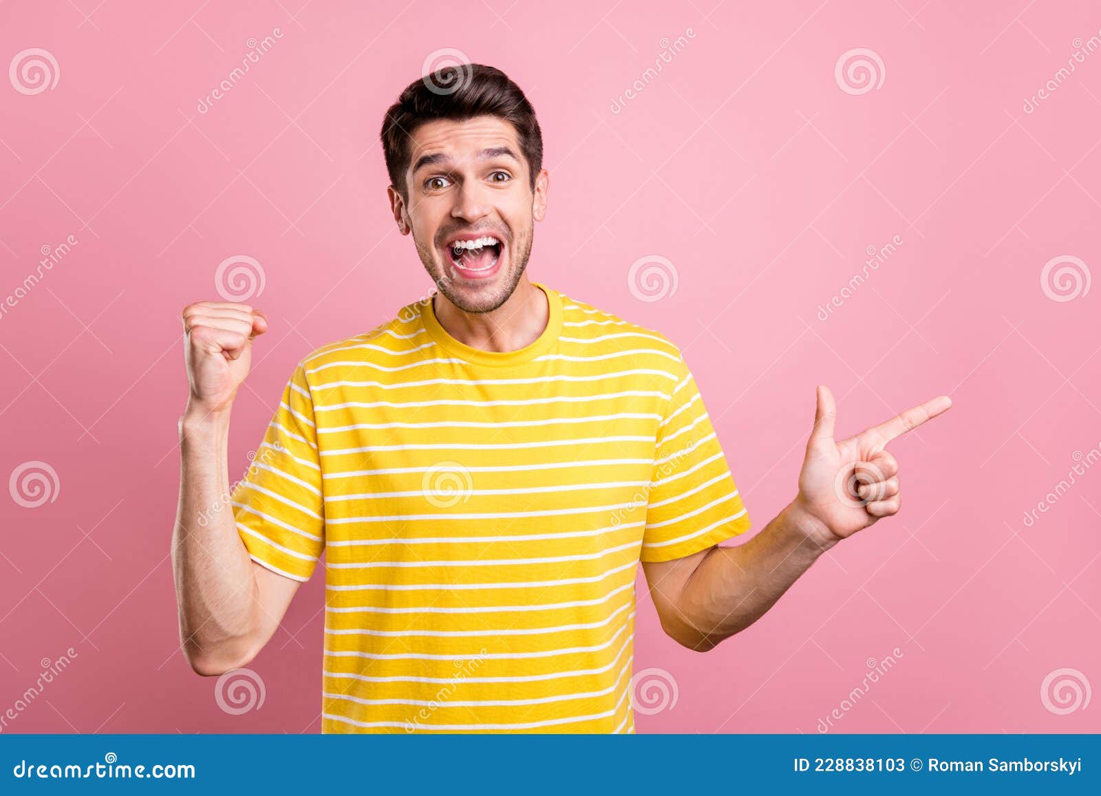 Photo Of Hooray Brunet Young Guy Point Empty Space Wear Yellow T Shirt
