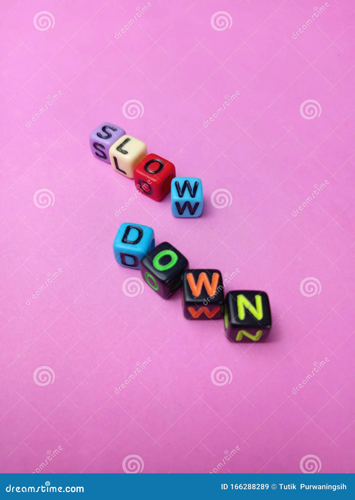 Photo Illustration, Word Slow Down from Plastic Alphabet Cube Beads ...