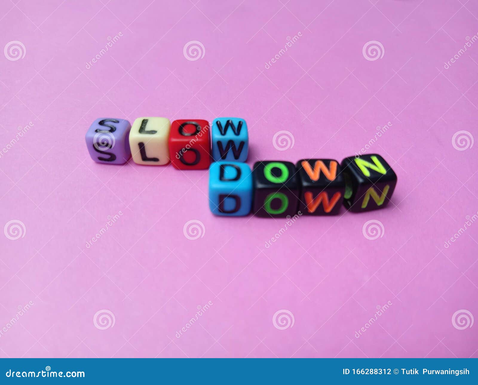 Photo Illustration, Word Slow Down from Plastic Alphabet Cube Beads ...