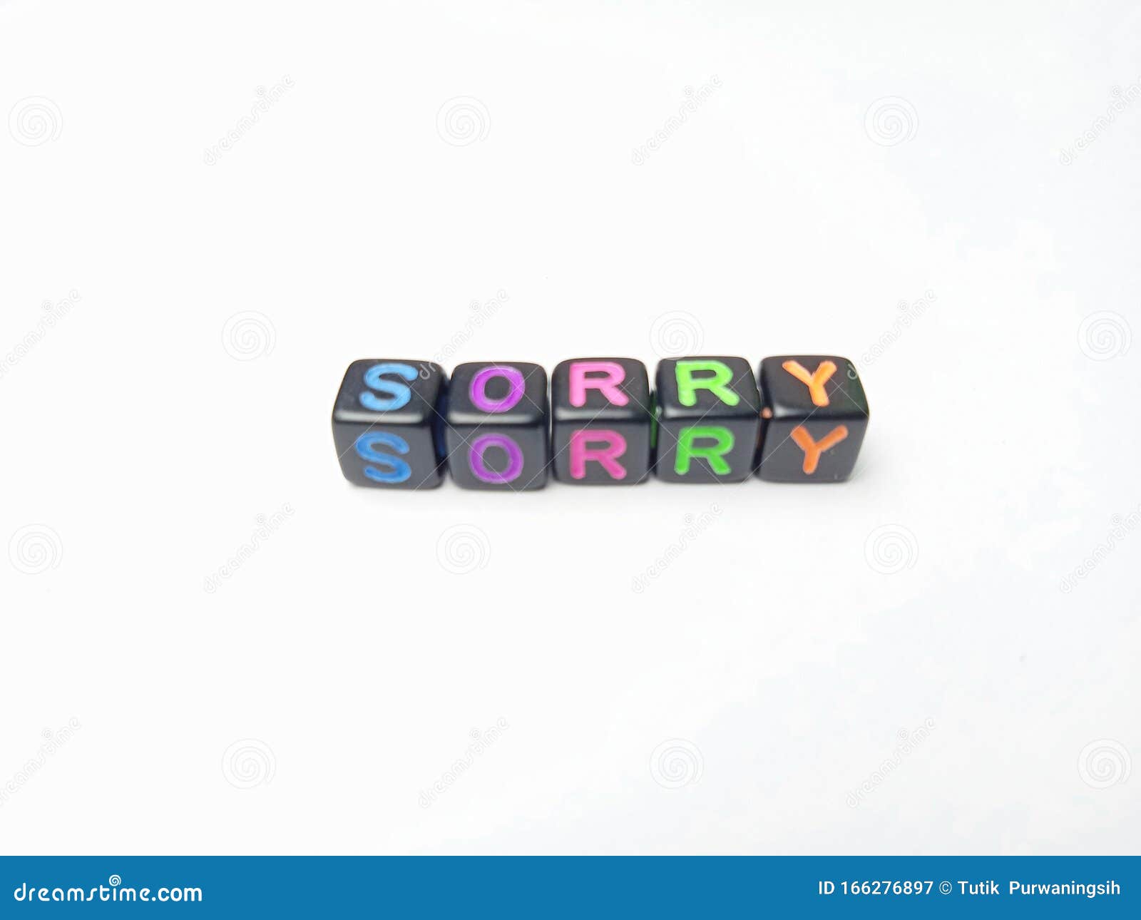Photo Illustration, Word Sorry from Black Plastic Alphabet Cube Beads ...