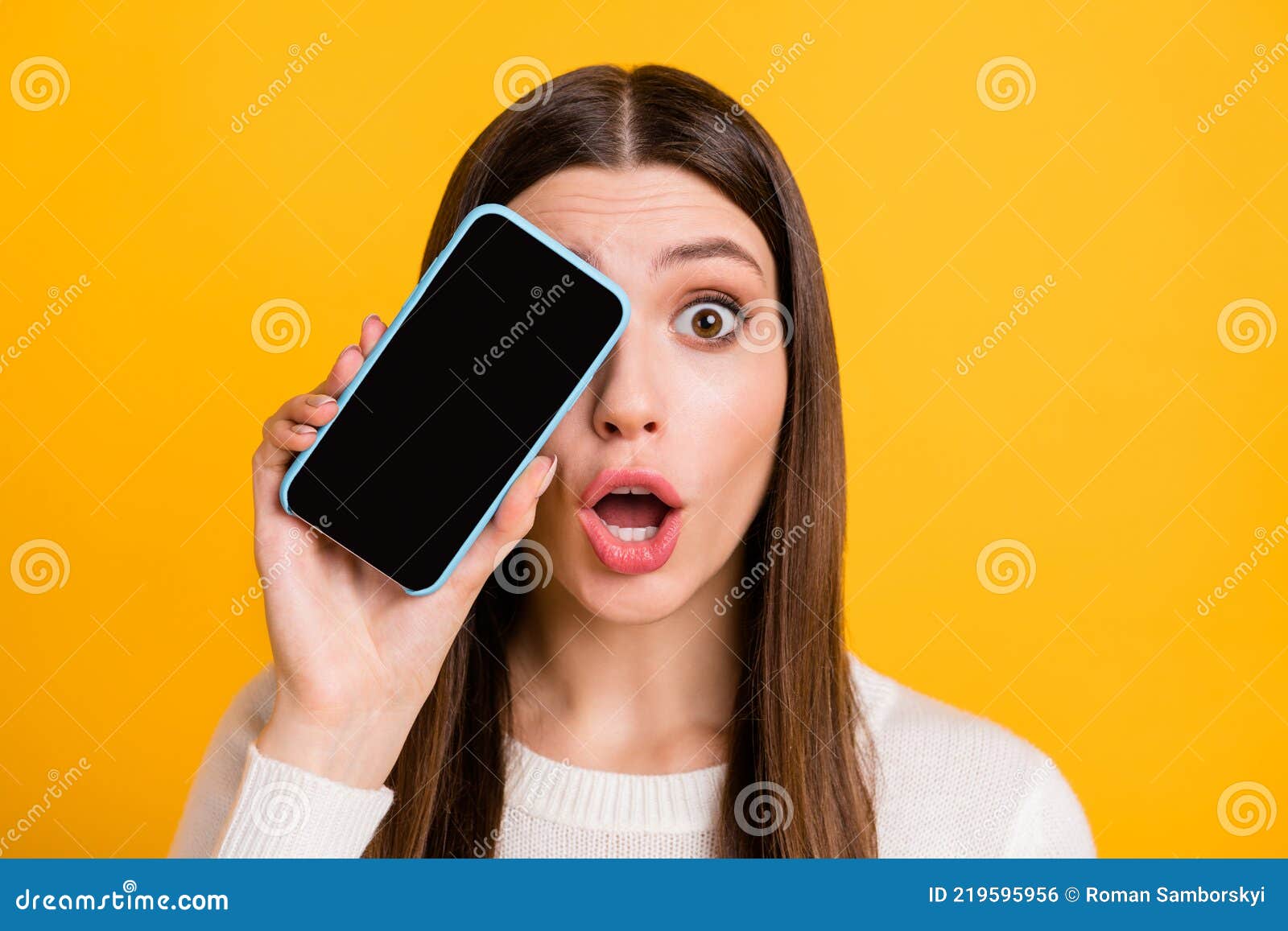 Photo Of Impressed Brunette Girl Show Telephone Wear White Sweater