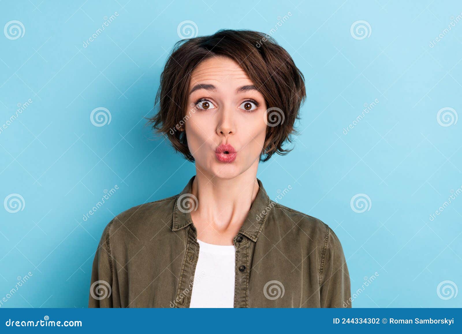 Photo Of Impressed Millennial Bob Hairdo Lady Look Camera Wear Khaki