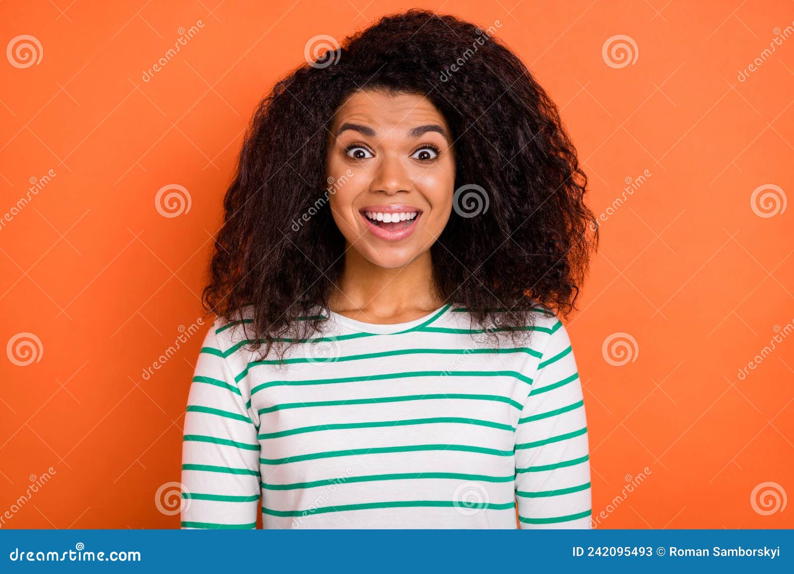 Photo Of Impressed Young Curly Hairdo Lady Look Camera Wear Striped