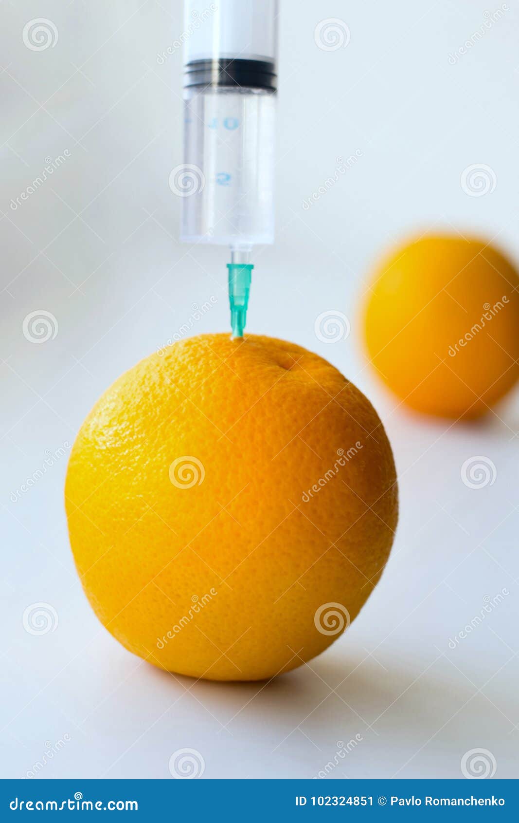 Photo of an Injection into an Orange on a Light Background Stock Image ...