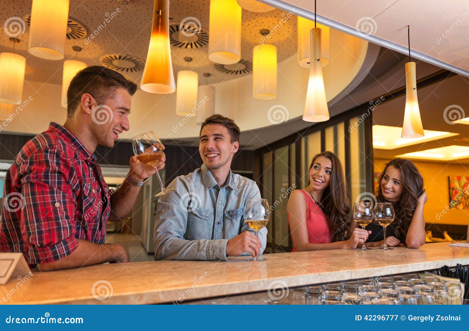 Photo of Joyful Friends in the Bar Communicating W Stock Image - Image ...