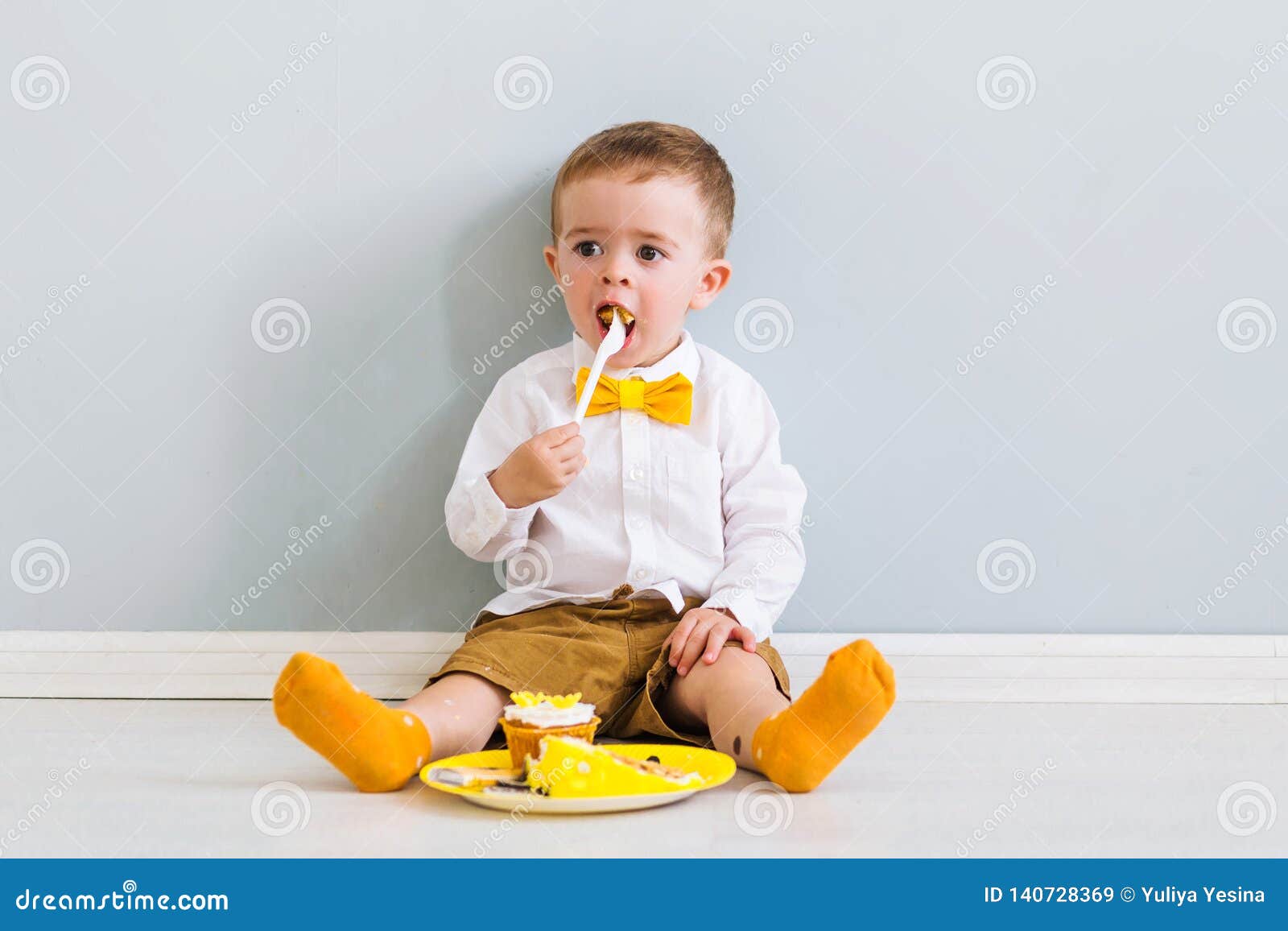 Little Boy Eats Cake Sitting on the Floor Stock Image - Image of indoor ...