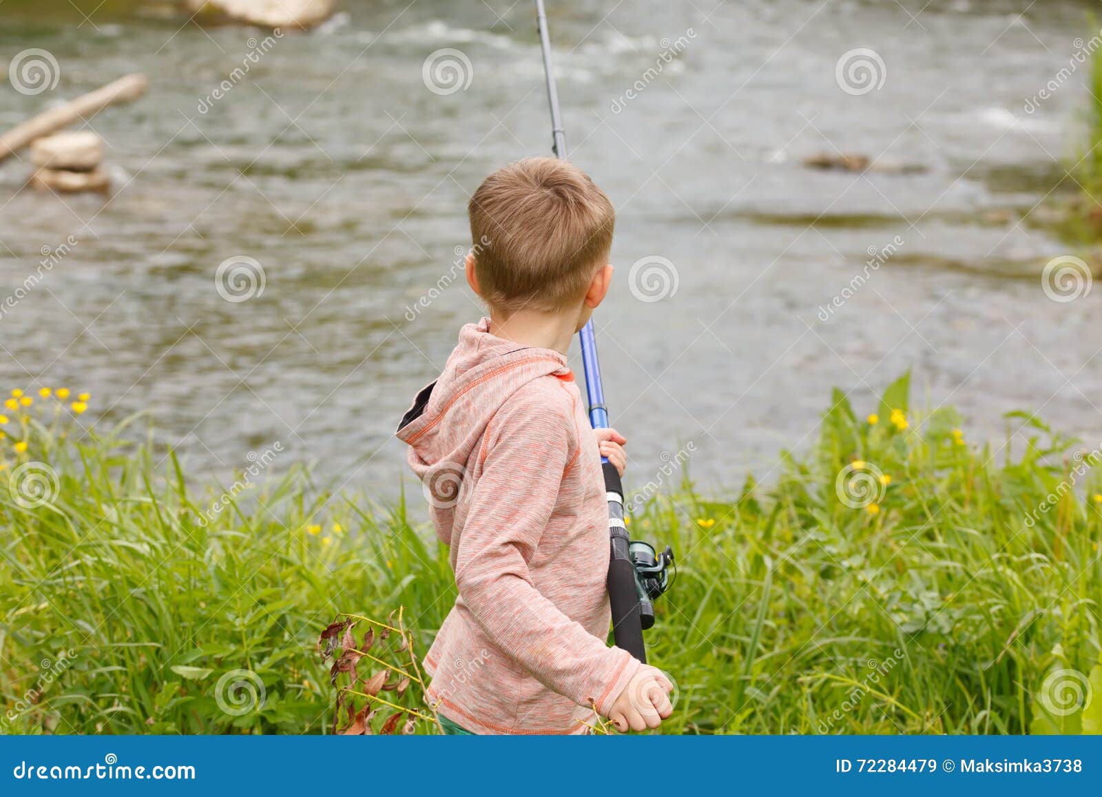 Photo of Little Kid Pulling Rod while Fishing on Weekend Stock Image ...