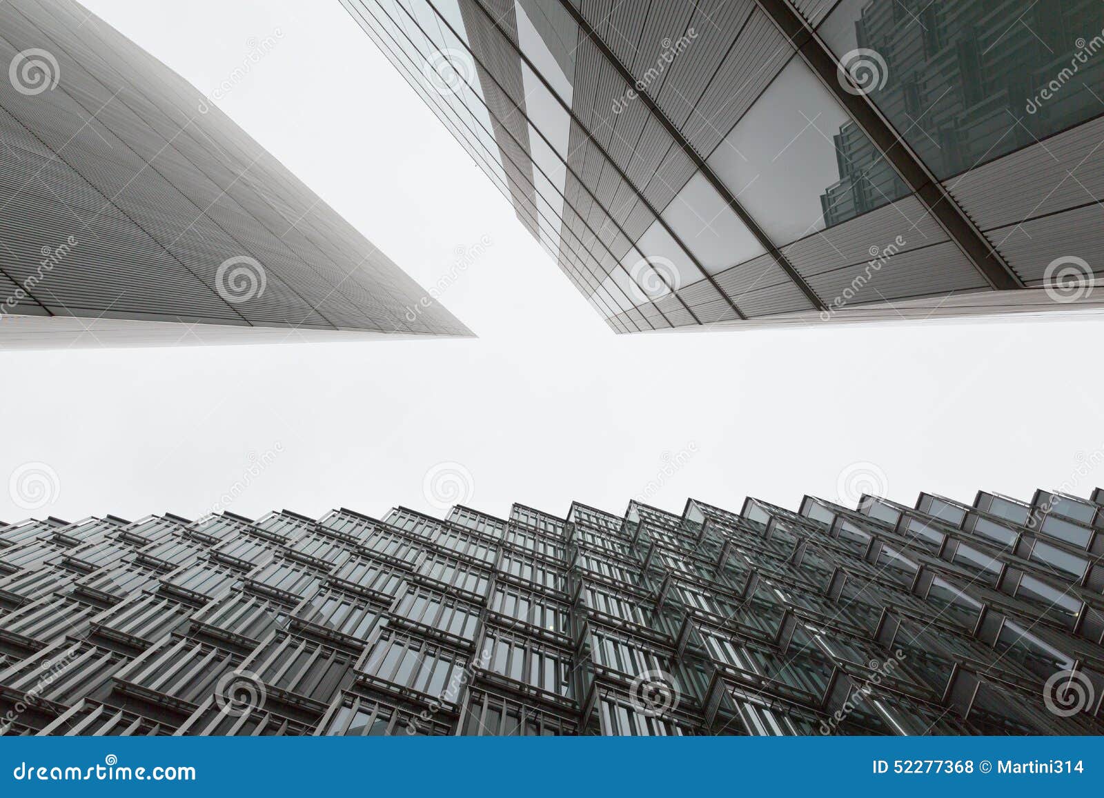 A Photo Looking Up Capturing Three Different Buildings on an Angle ...