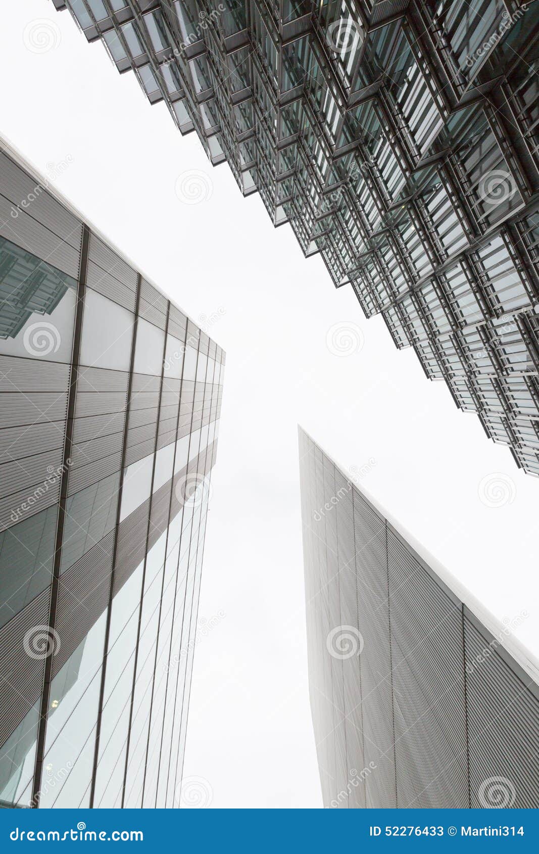 A Photo Looking Up Capturing Three Different Buildings on an Angle ...