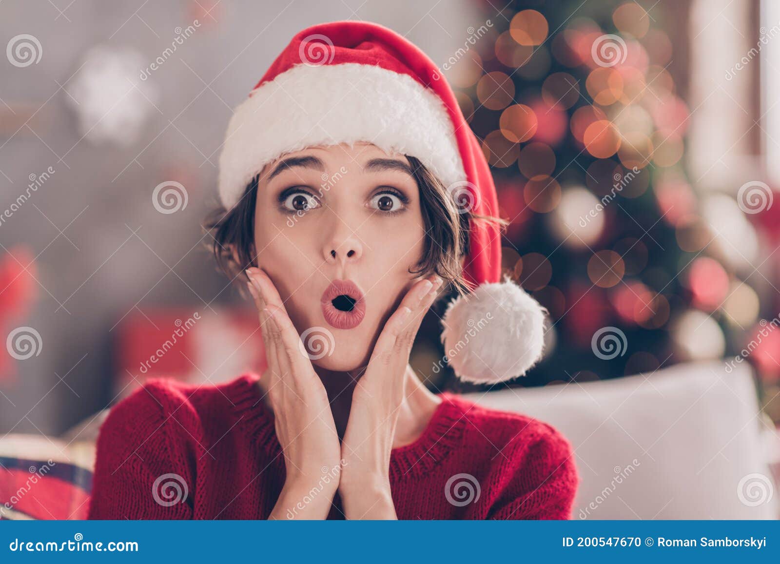 Photo Of Lovely Amazed Young Lady Arms Cheekbones Open Mouth Wear Santa