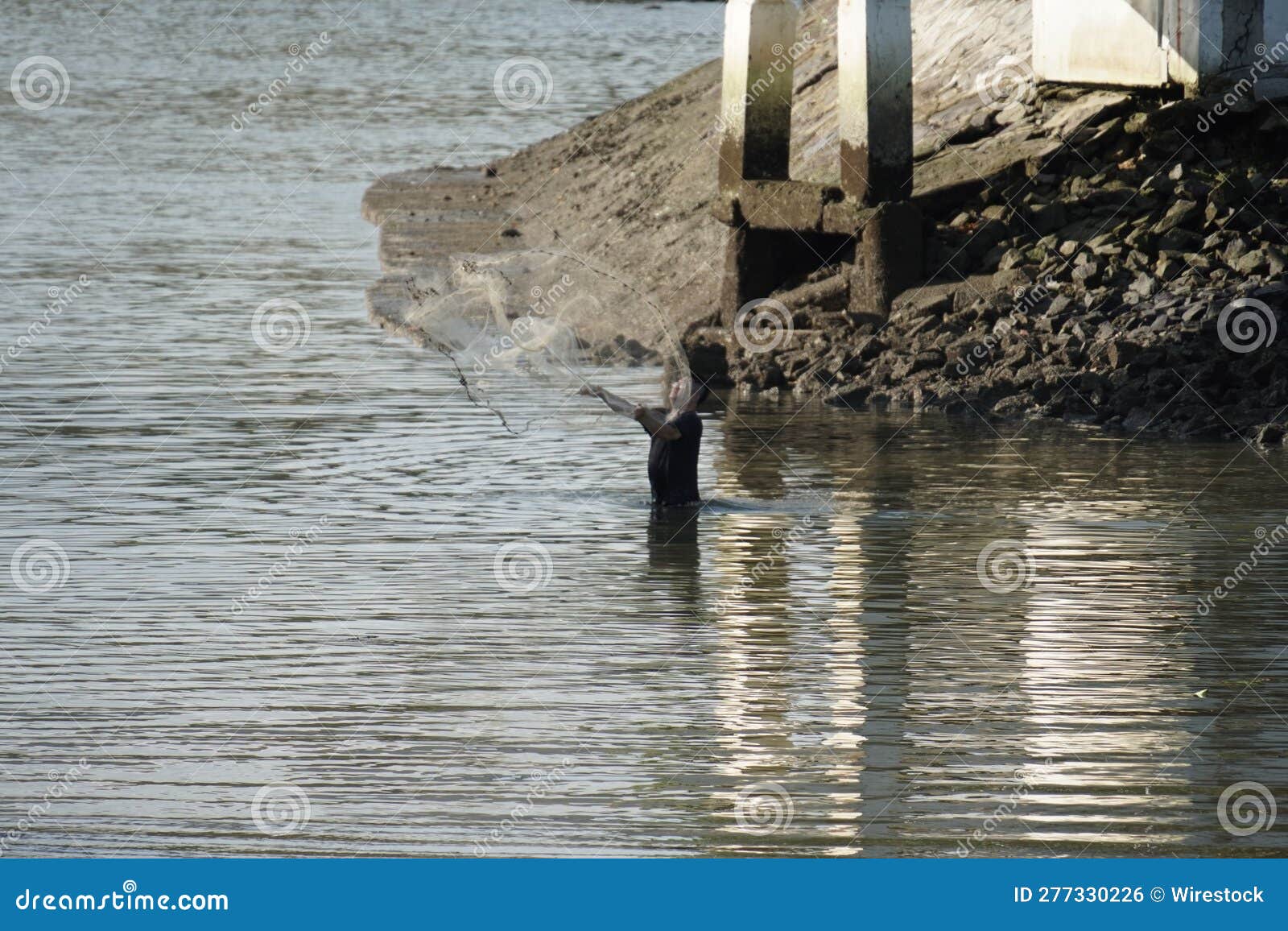 A Photo of a Man Casting a Fishing Net Editorial Photo - Image of ...