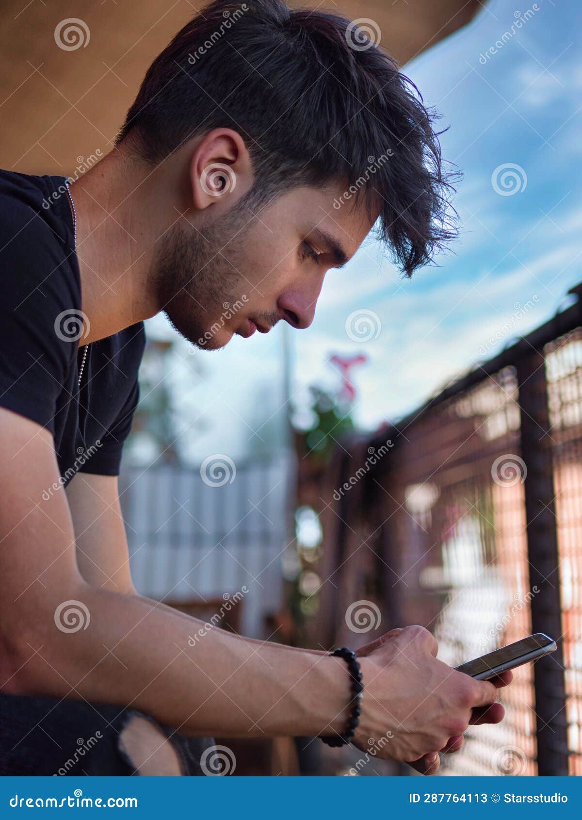 Photo of a Man Engrossed in His Smartphone Stock Image - Image of ...