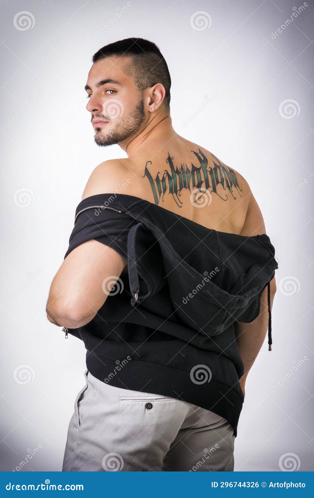 Photo of a Man Showcasing a Striking Tattoo on His Back Stock Photo ...