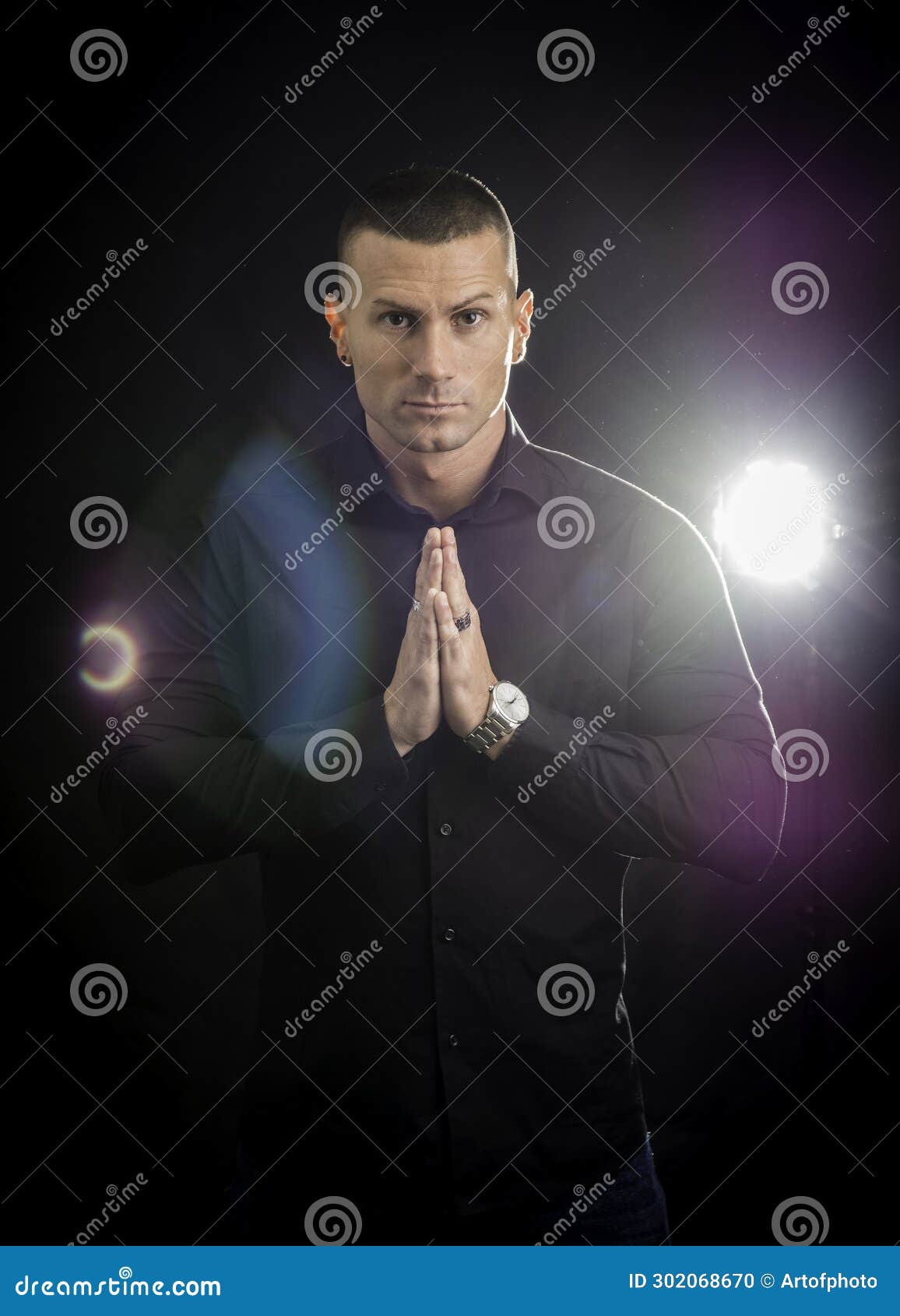Photo of a Man Standing in Front of a Spotlight Stock Photo - Image of ...