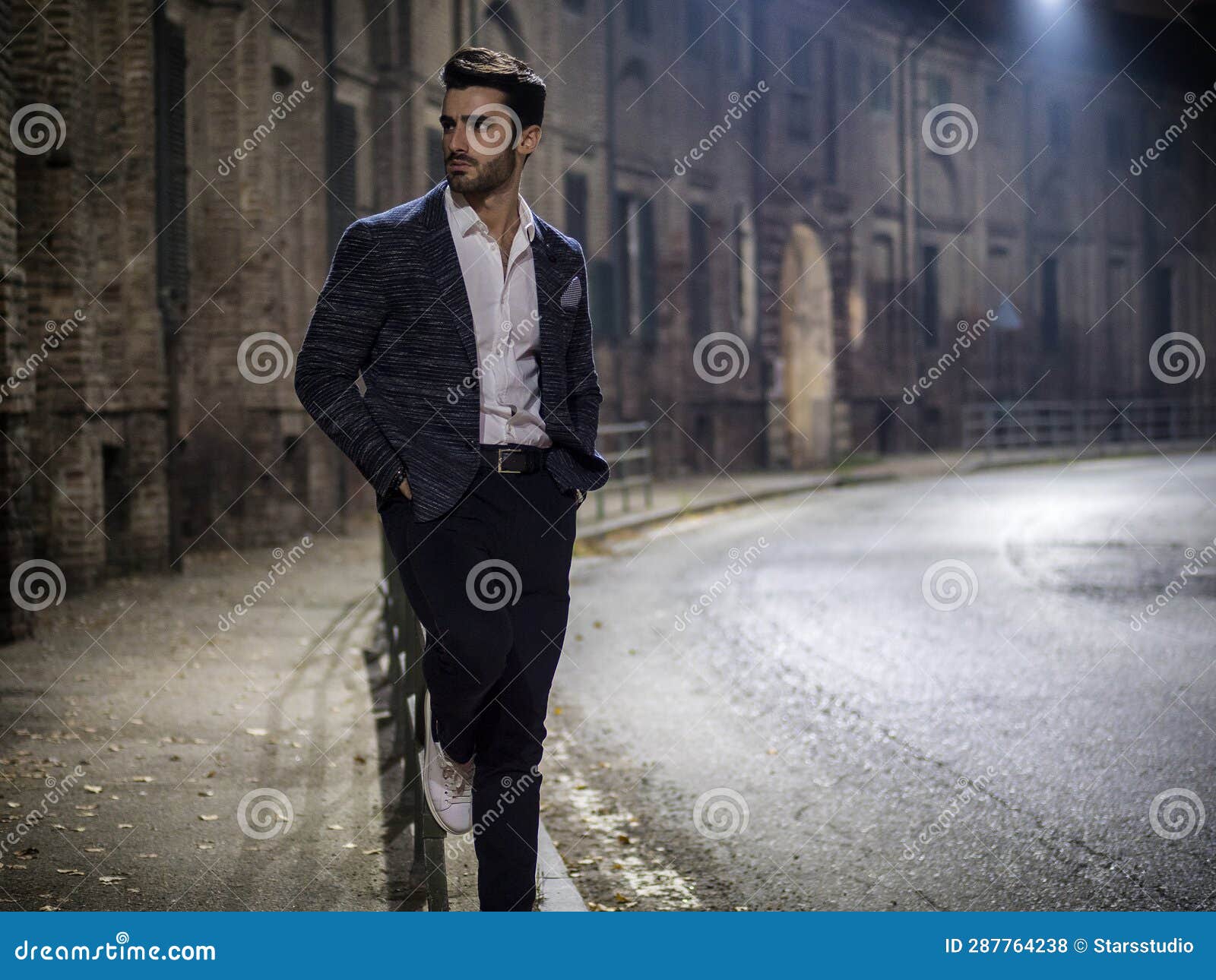 Photo of a Man Standing on the Side of a Street Stock Photo - Image of ...
