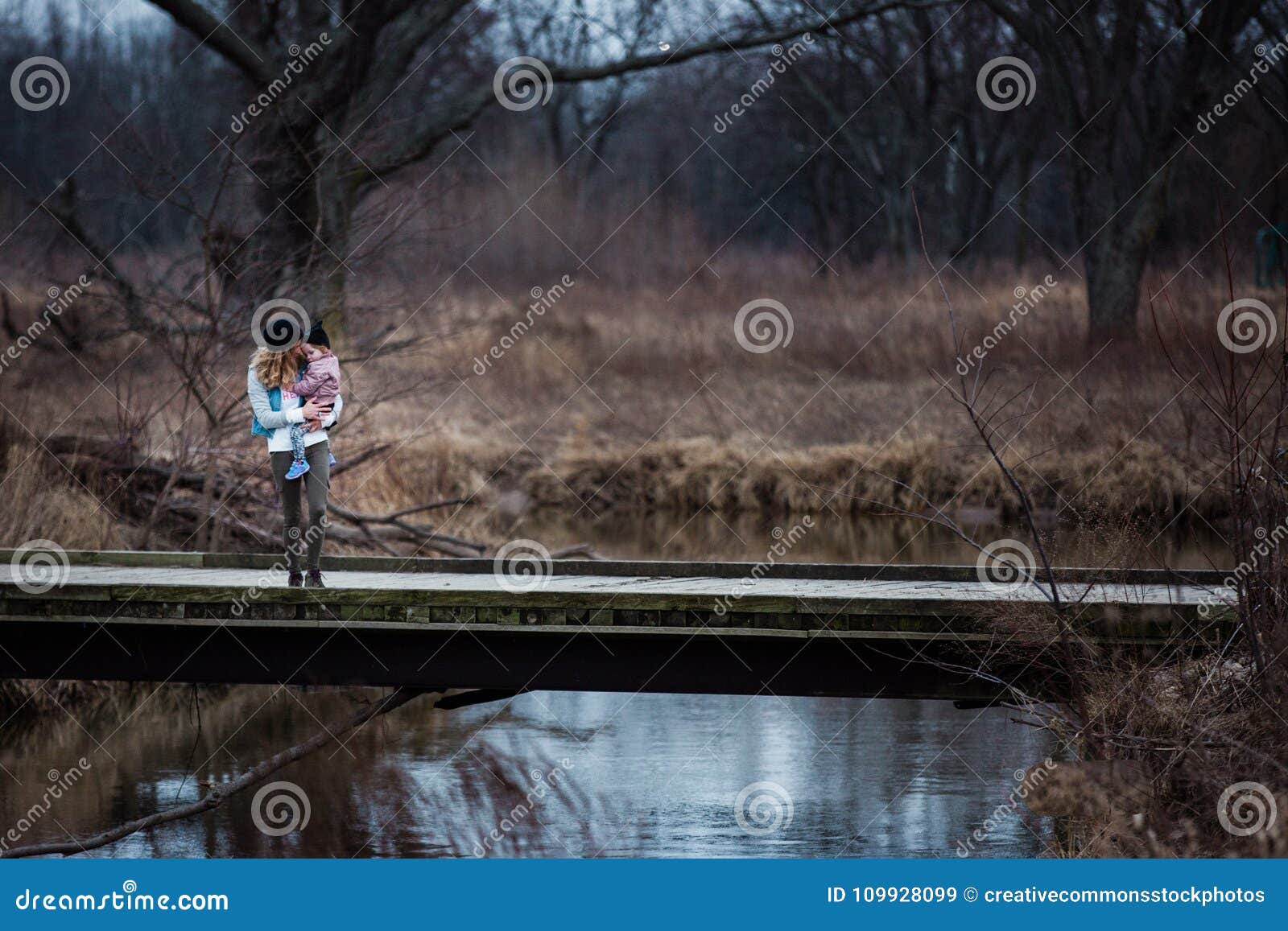 Photo Of Mother And Child Standing On The Bridge Picture. Image: 109928099