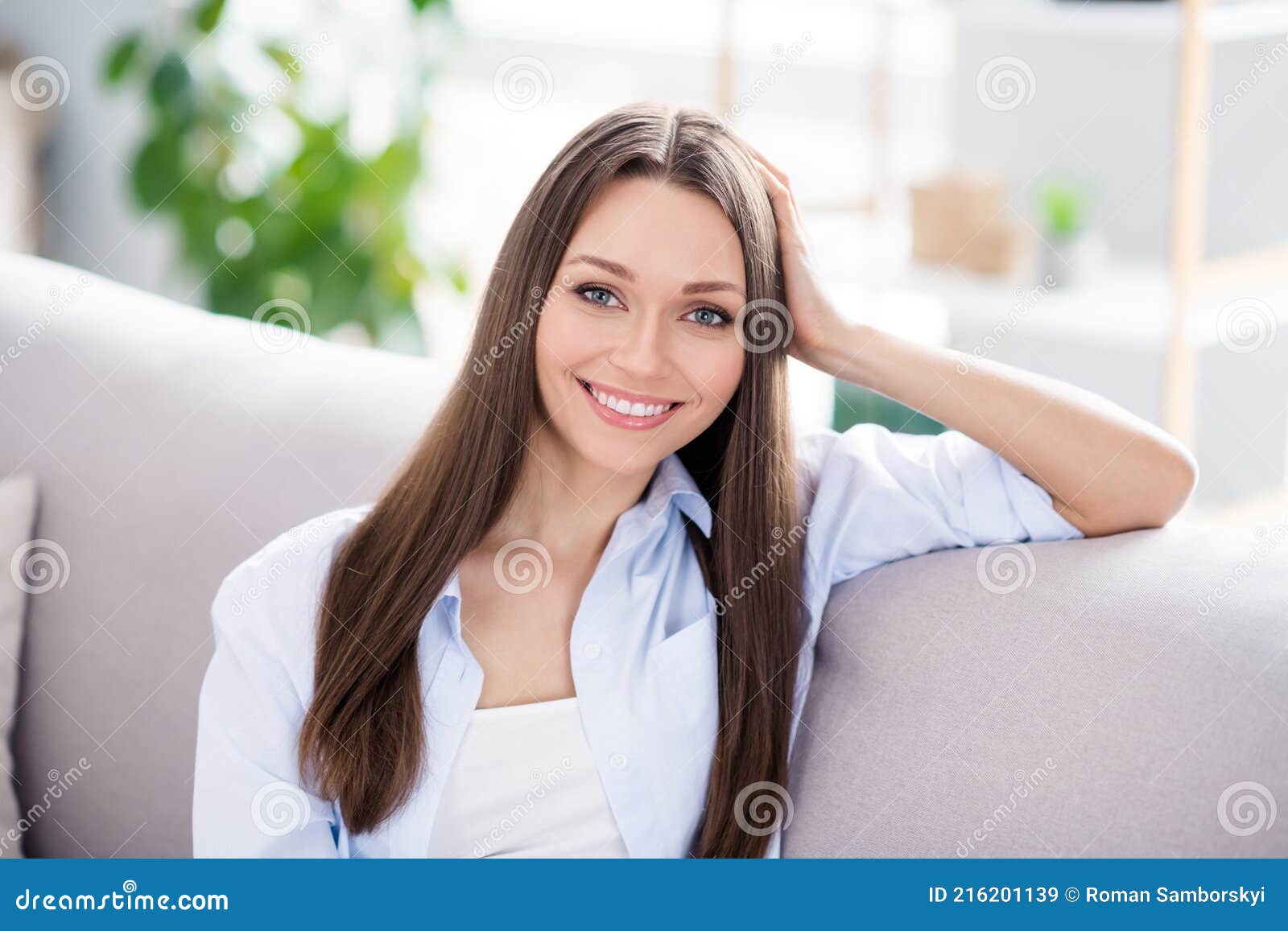 Photo Of Nice Optimistic Brunette Long Hairdo Lady Sit On Coach Wear