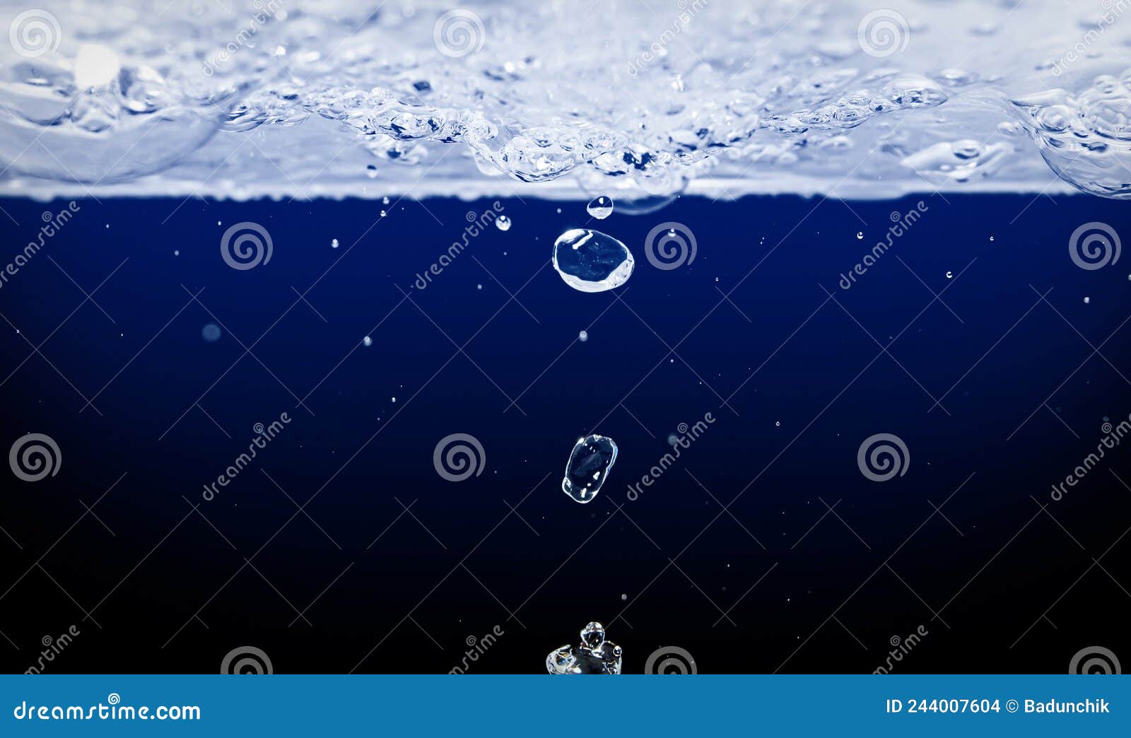 Photo of Water Trickle and Drops on Dark Blue Background Stock Photo ...