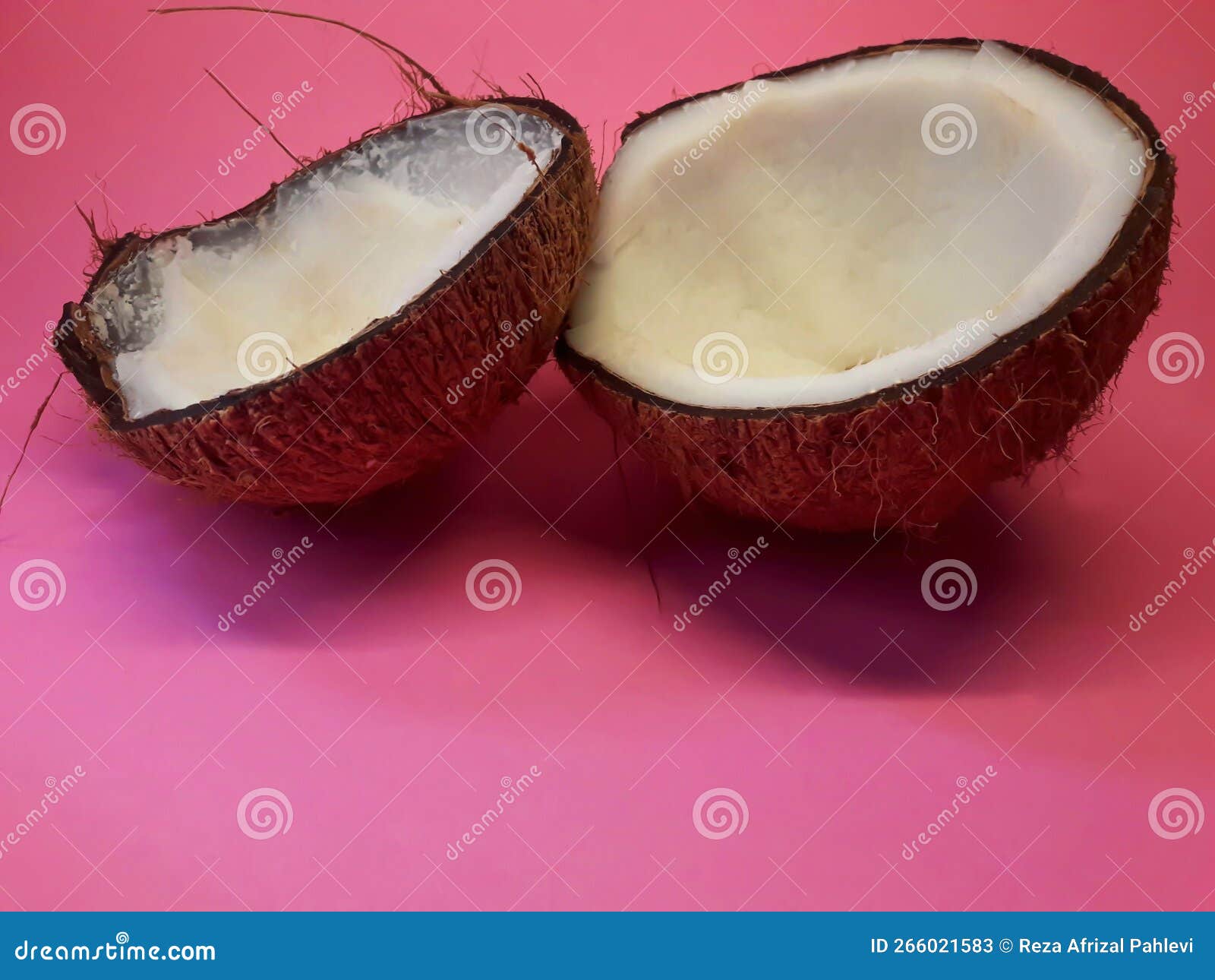 Photo of an Old Split Coconut with a Pink Background Stock Image ...