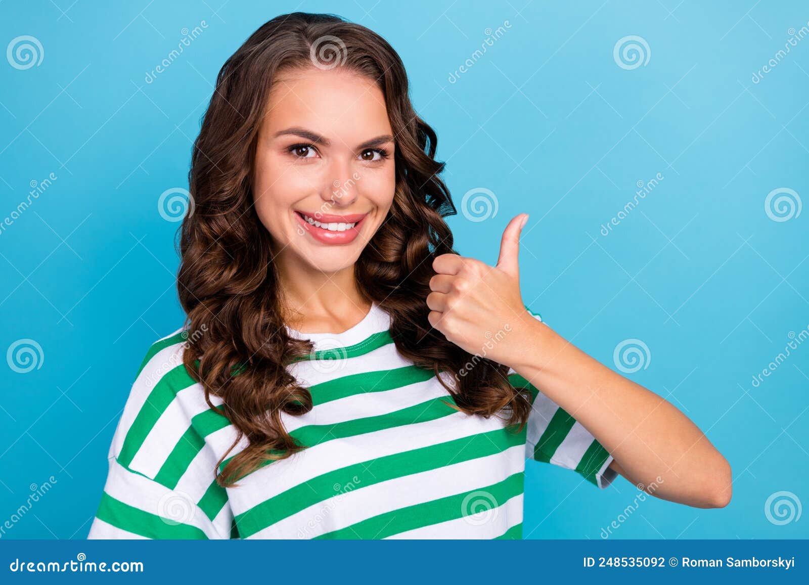 Photo Of Optimistic Brunette Wavy Millennial Lady Show Thumb Up Wear