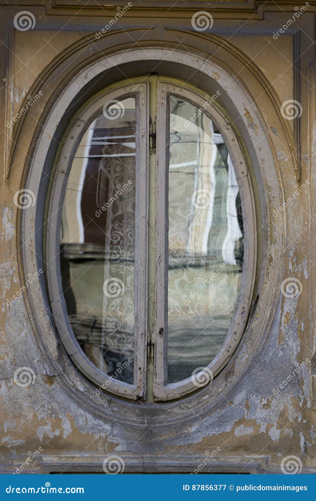 Photo Of An Oval Shaped Window Frame On Old House Facade. Picture Image ...