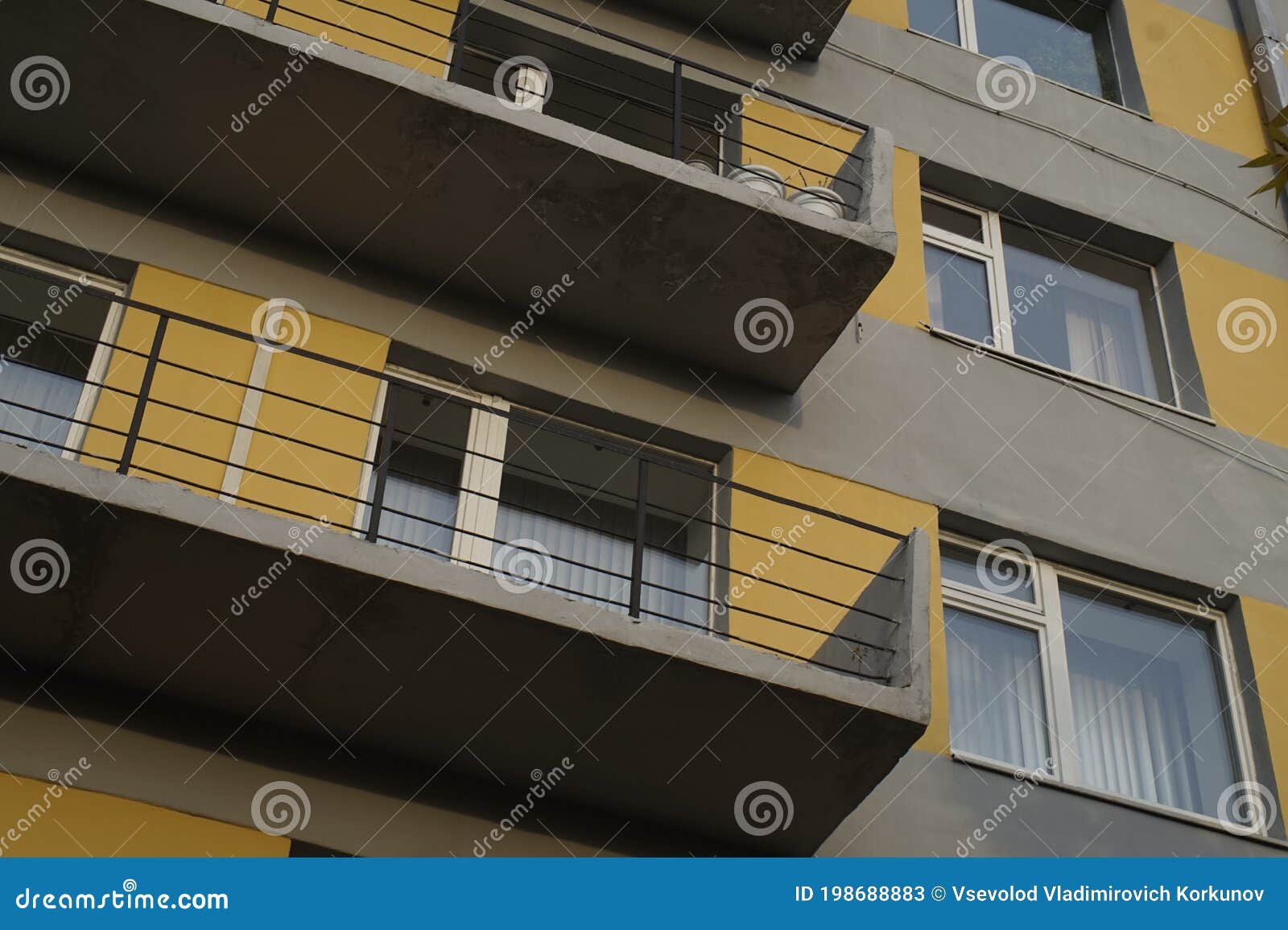 Photo of Part of the Building`s Facade. Balconies, Metal Railings, and ...