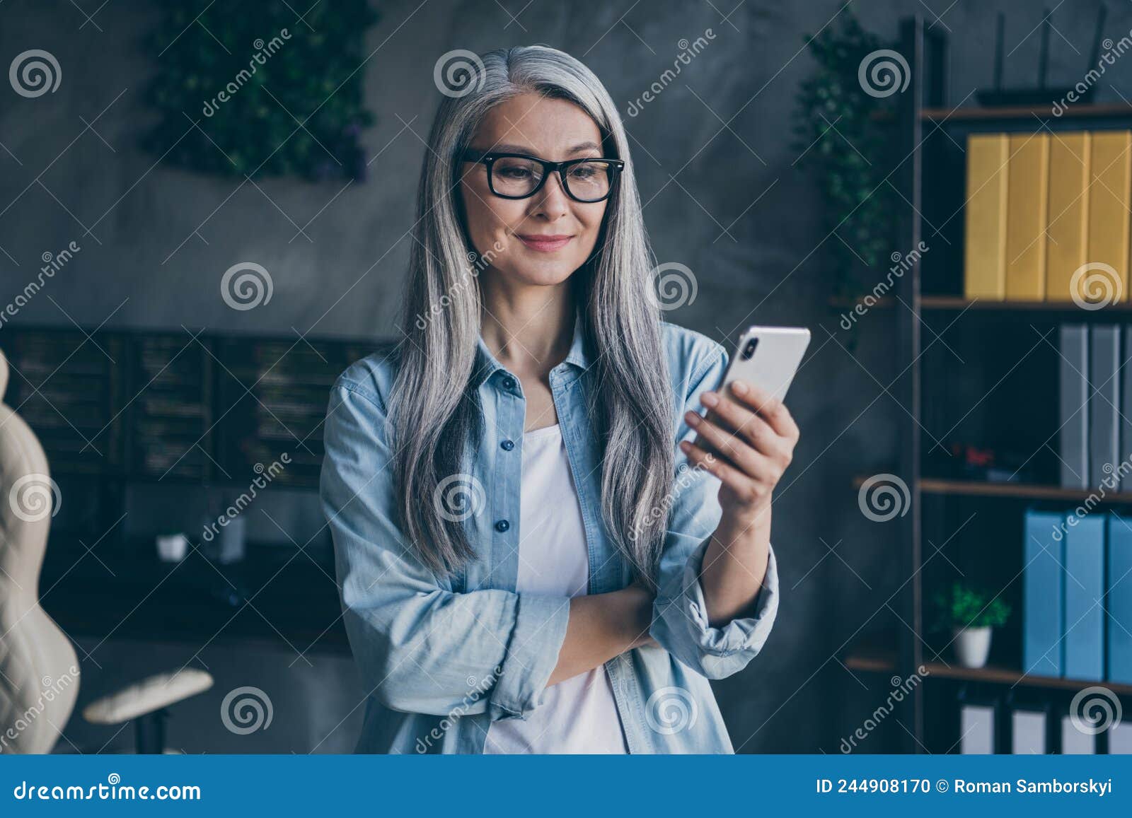 Photo of Pensioner Retired Lady Use Smart Device Read Colleagues ...