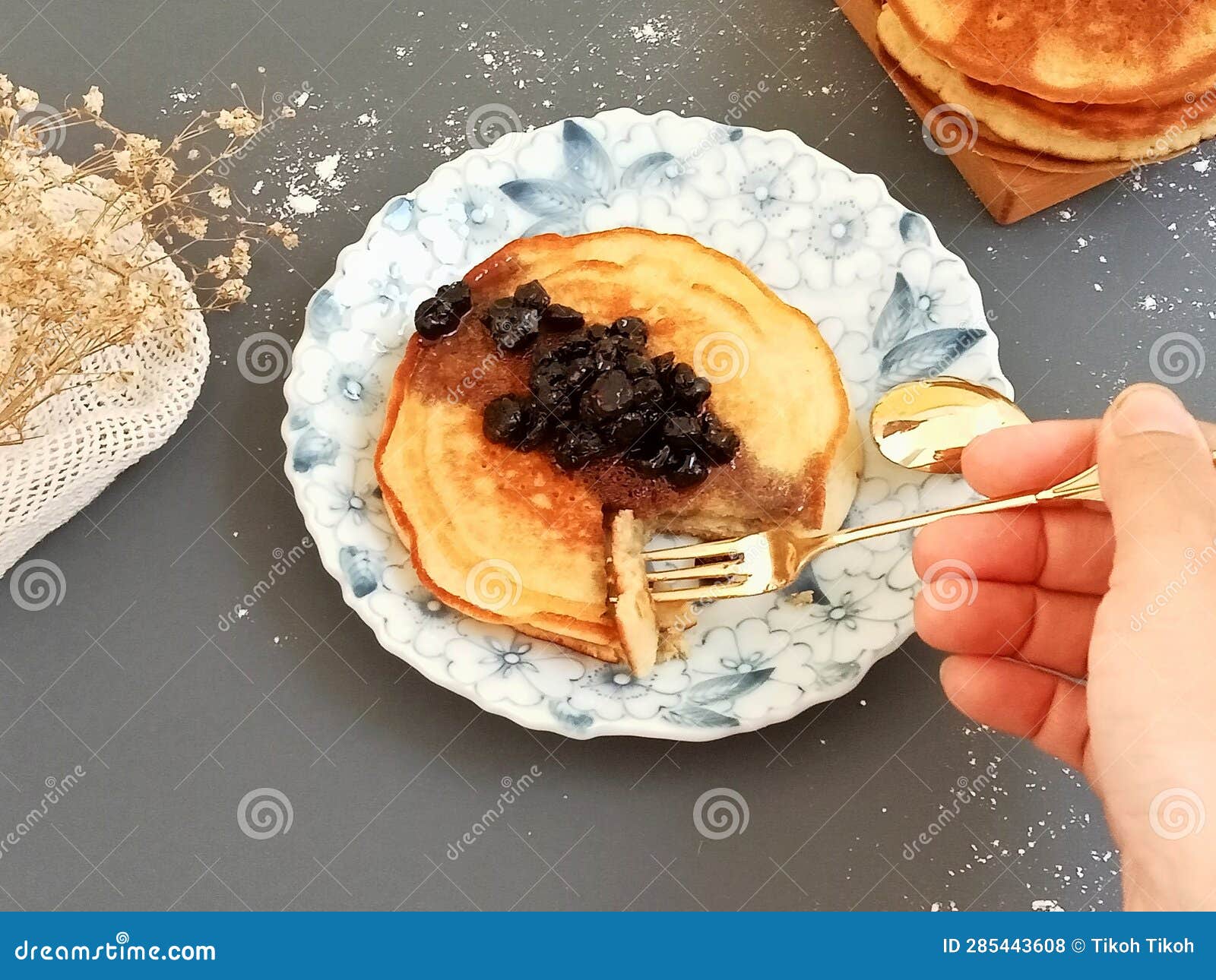 Photo of a Plate of Pancakes with a Hand Holding a Fork Stock Photo ...