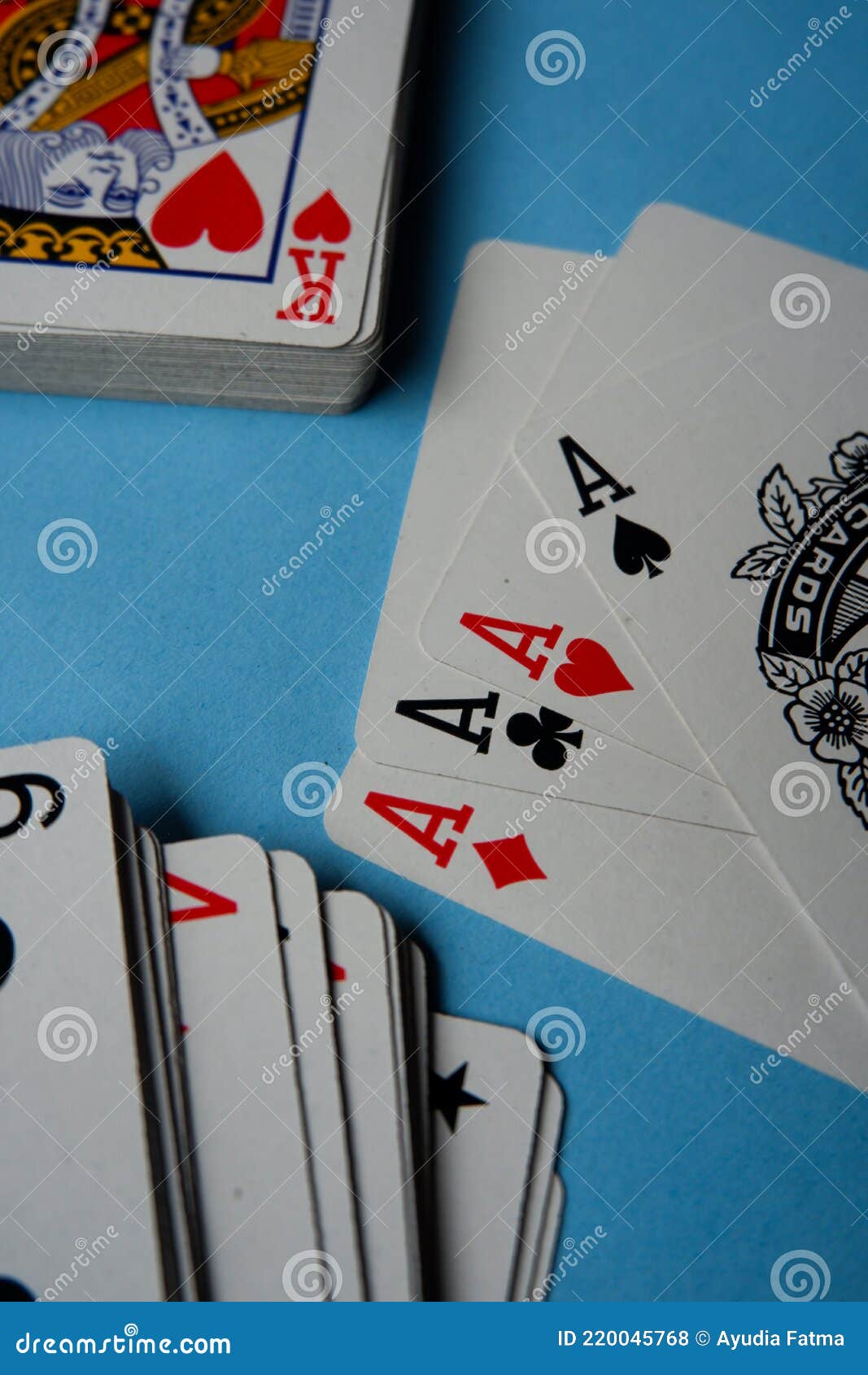 Photo of Playing Cards Neatly Arranged on a Blue Background Stock Photo ...