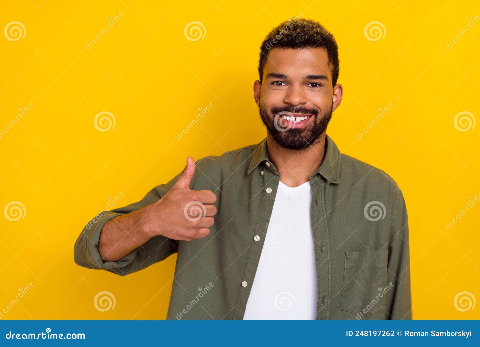 Photo Of Pretty Confident Guy Dressed Green Shirt Showing Thumb Up