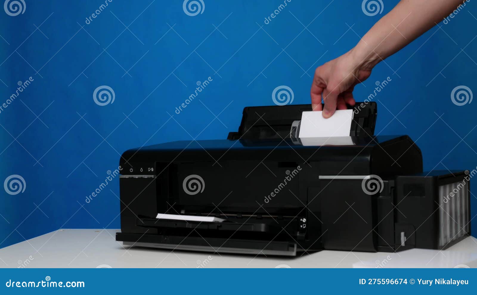 Photo Printer and Blank Sheets of Photo Paper are Inserted into the ...