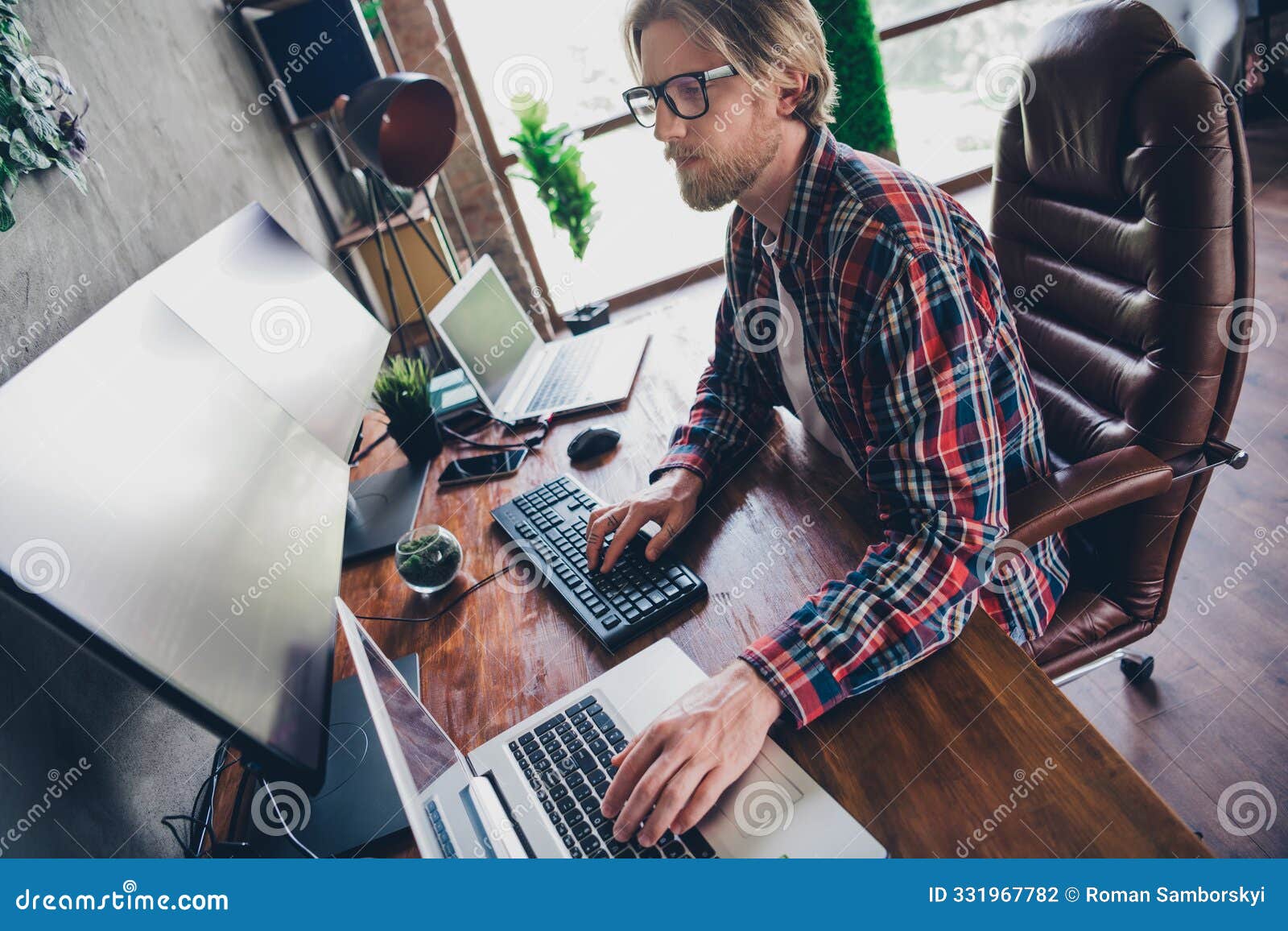 Photo of Professional Young Blond Hair Hacker Guy at Loft Design Modern ...