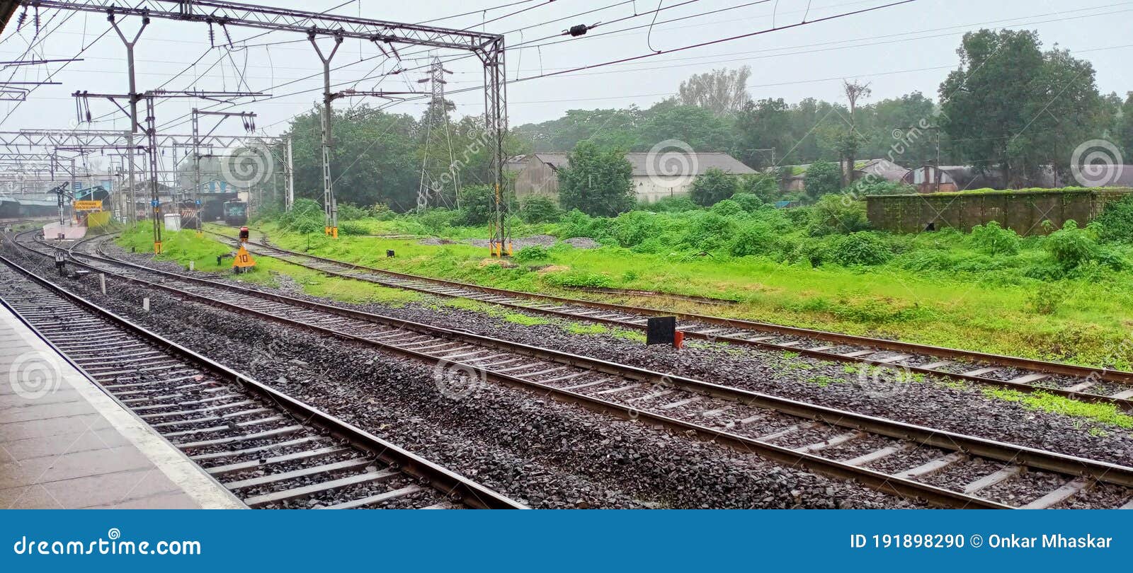 Photo of Railway Track and Station Stock Photo - Image of plants, track ...