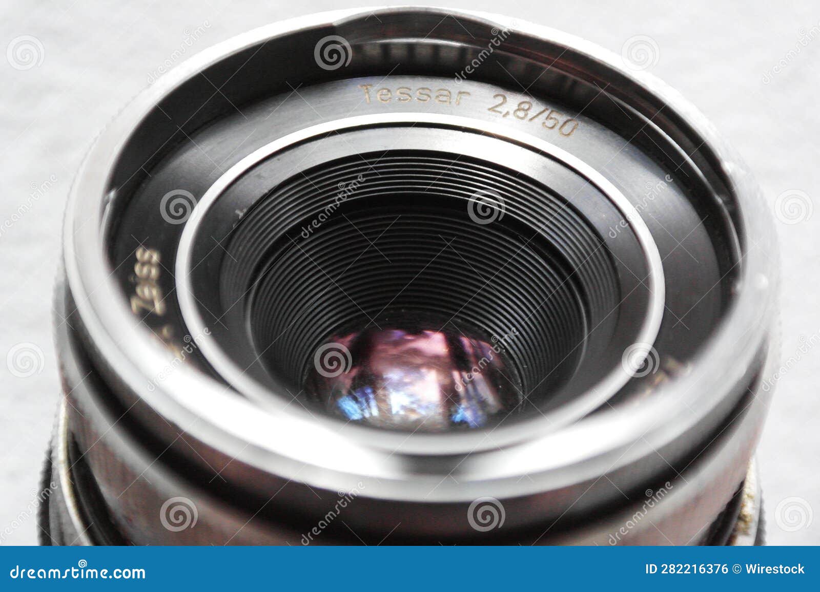 A Photo of the Reflection of a Camera Lens on Its Body Stock Photo ...