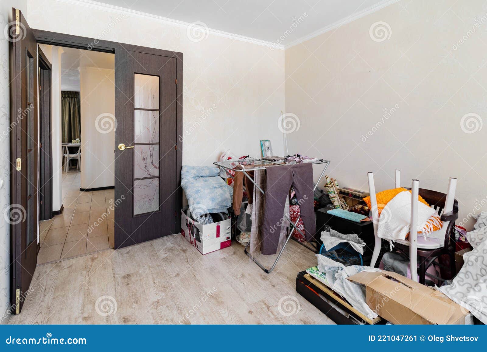 In the Photo, a Room with Scattered Things Boxes, a Mess in the Room ...