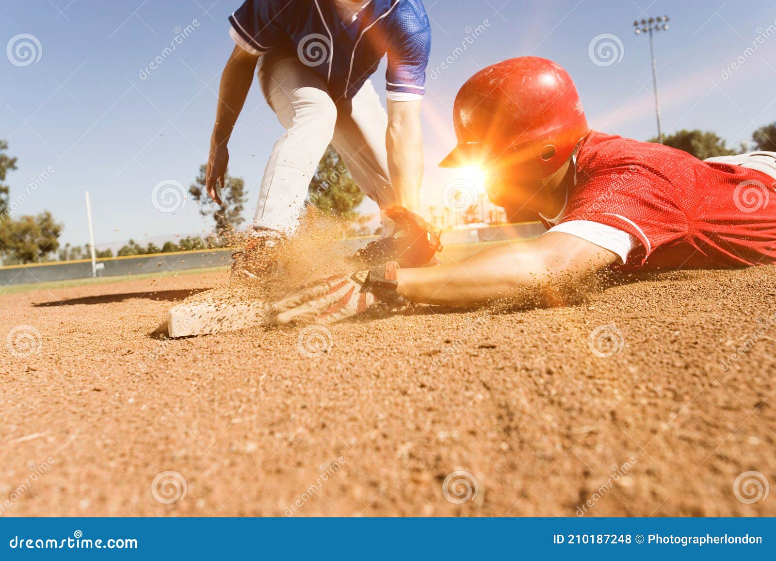 Photo of Runner and Infielder Both Reaching Base Stock Photo - Image of ...