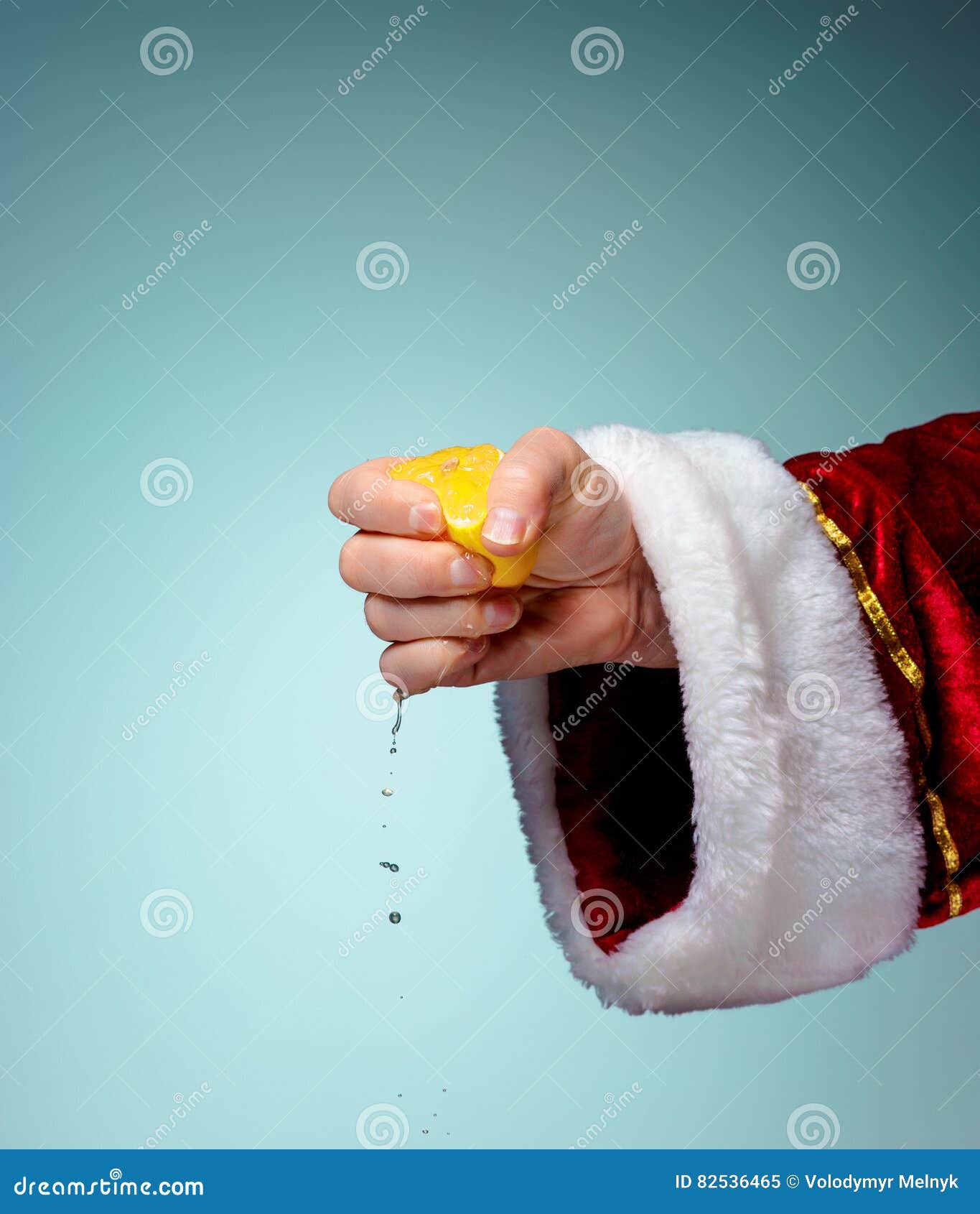 Photo of Santa Claus Hand Squeezing Lemon Stock Image - Image of drink ...