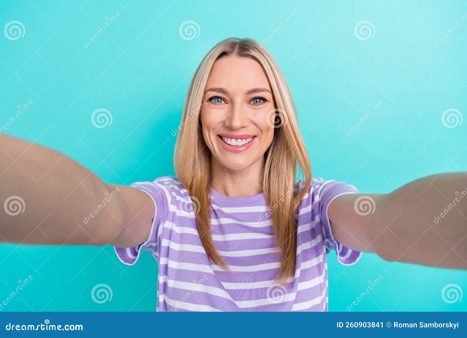 Photo Of Satisfied Glad Pleasant Woman With Straight Hairdo Dressed