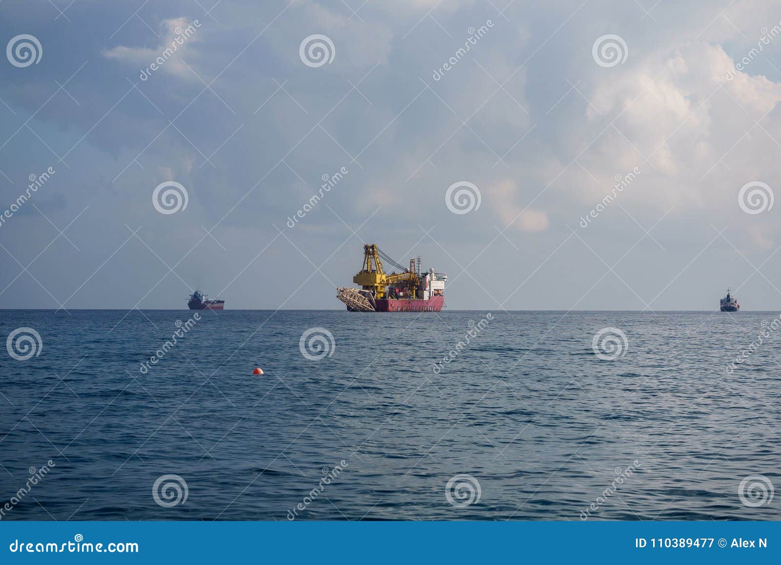 Photo of Sea with Floating Cargo Ship Stock Image - Image of business ...