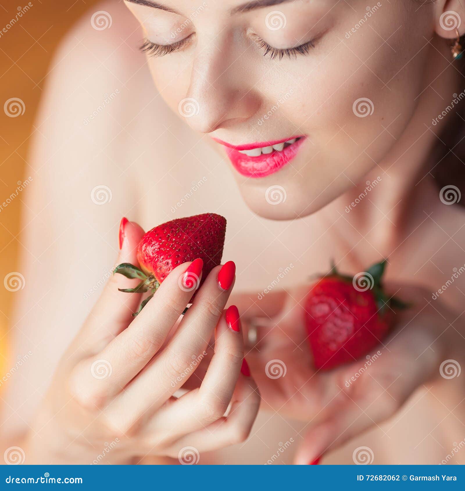 Photo Of Seductive Female Holding Strawberry Near Face Eyeys Closeup