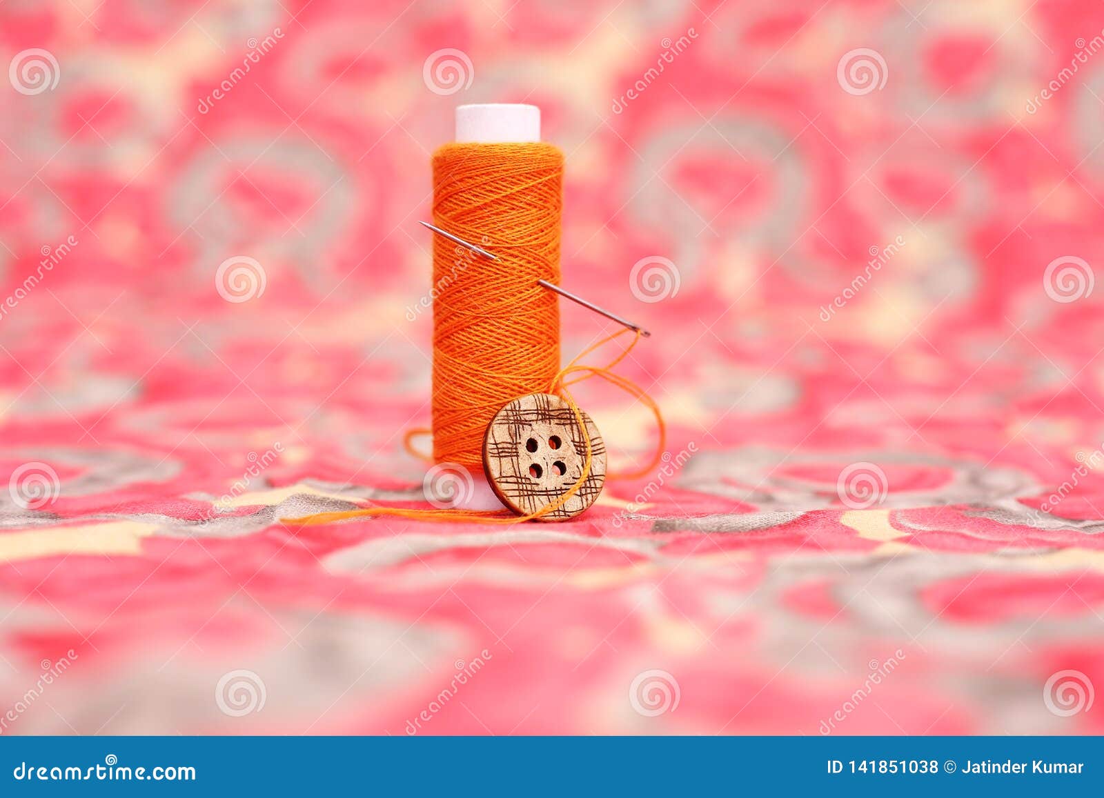 Photo of Sewing Thread and Button Stock Photo - Image of button, needle ...