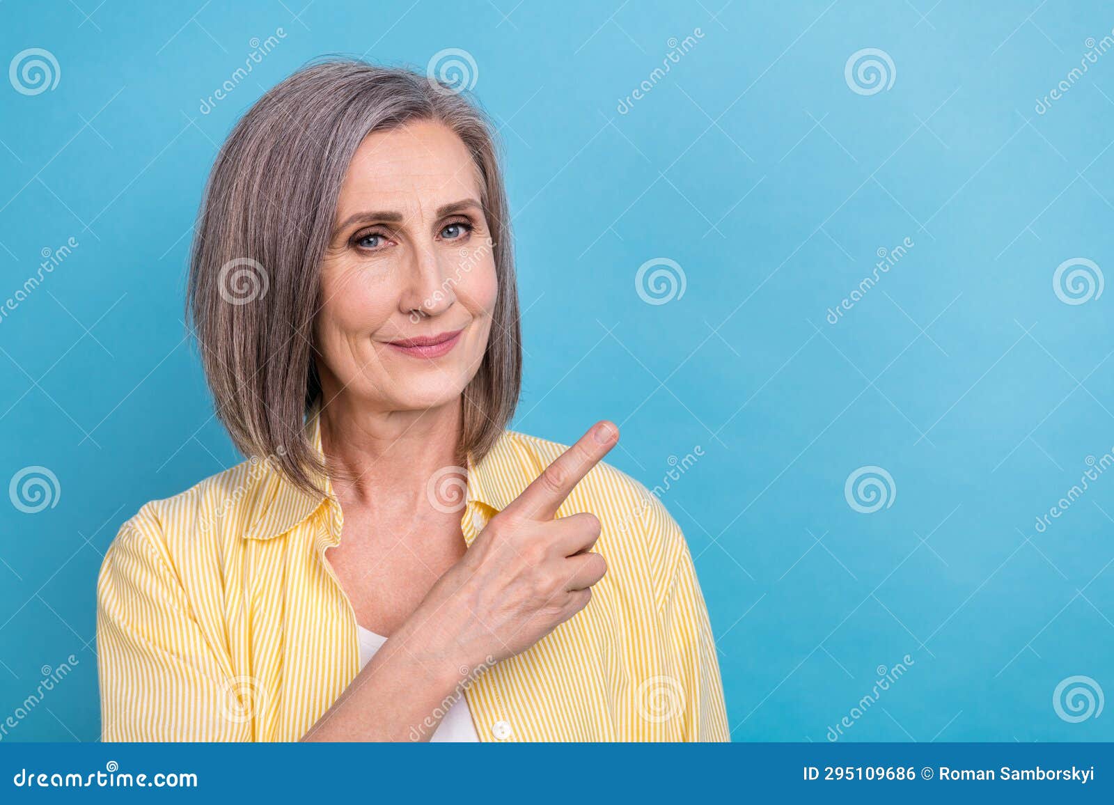 Photo Of Shiny Adorable Woman Dressed Yellow Shirt Showing Finger Empty