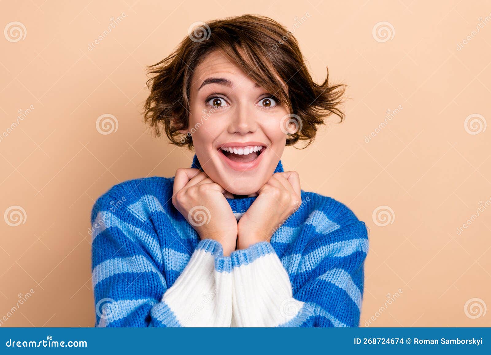 Photo Of Shiny Excited Lady Wear Blue Pullover Holding Arms Collar Open