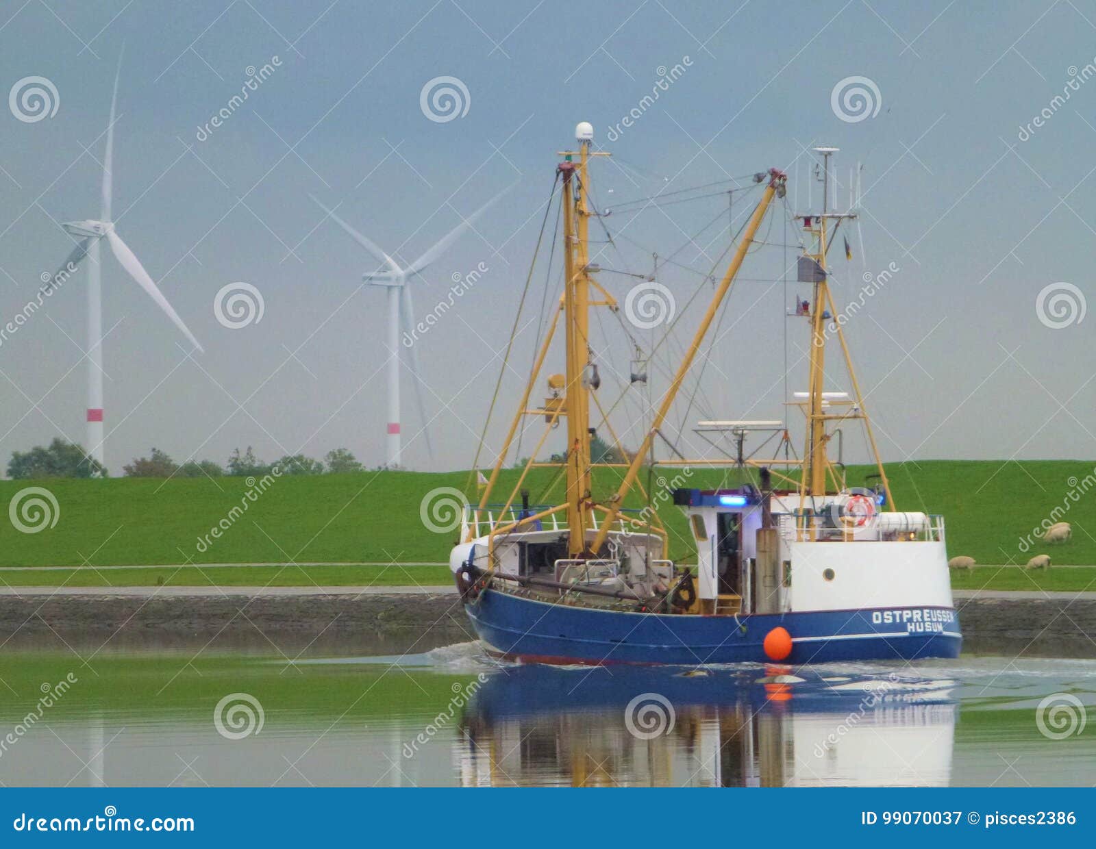 Ship and Meadow with Wind Wheel Editorial Photography - Image of ocean ...