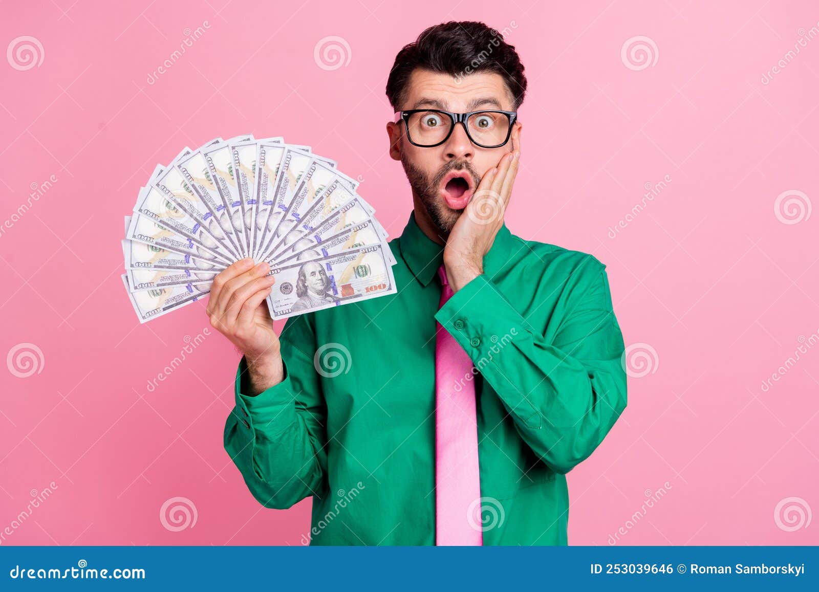 Photo Of Shocked Impressed Man Dressed Green Shirt Eyewear Holding